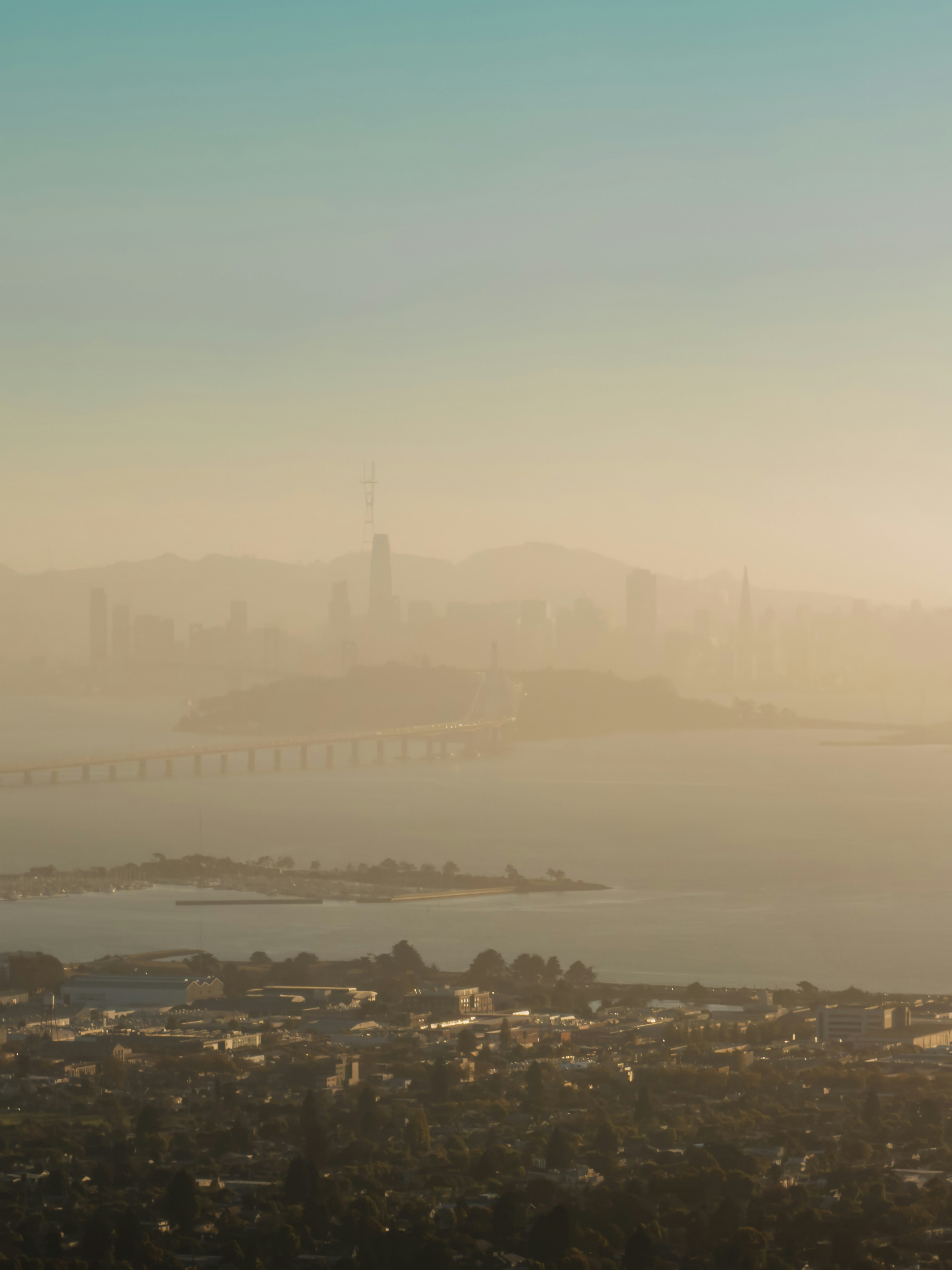 Golden Mist Over the Bay: City Silhouette at Dawn
