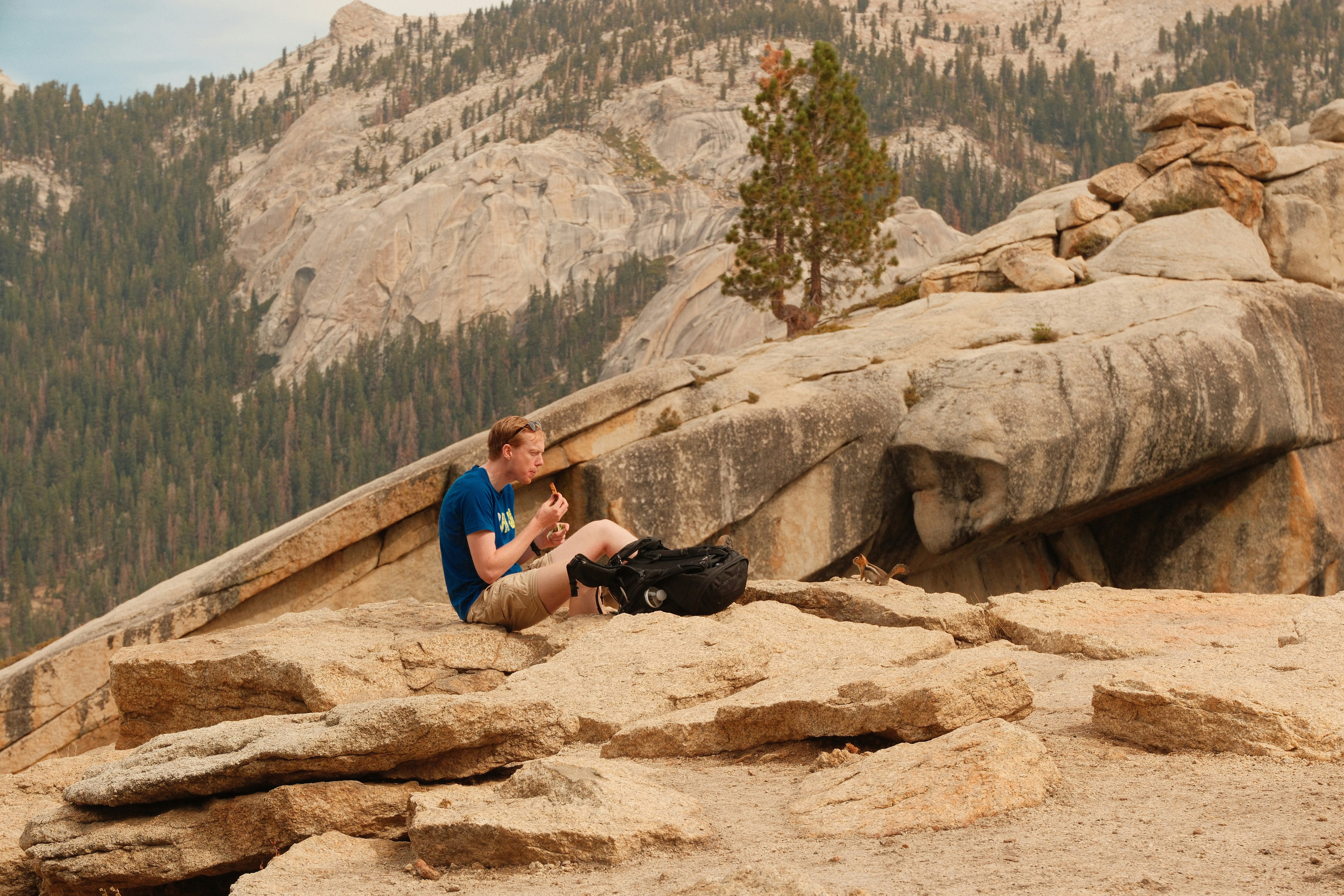 Rocky Ridge Break: A Camper Takes a Quiet Break on Sierra Granite