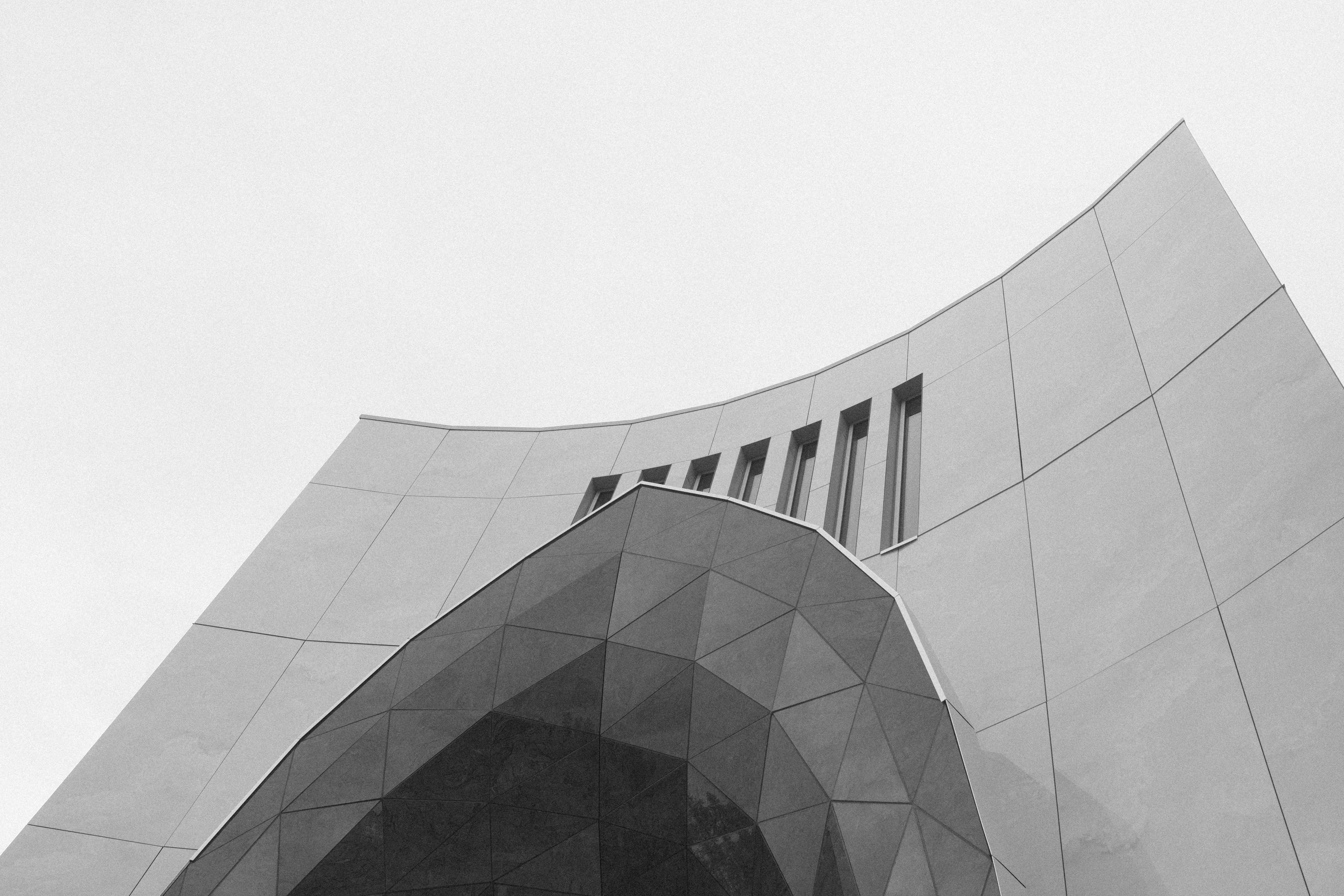 Curved Archway Precision: Facade Geometrics in Monochrome