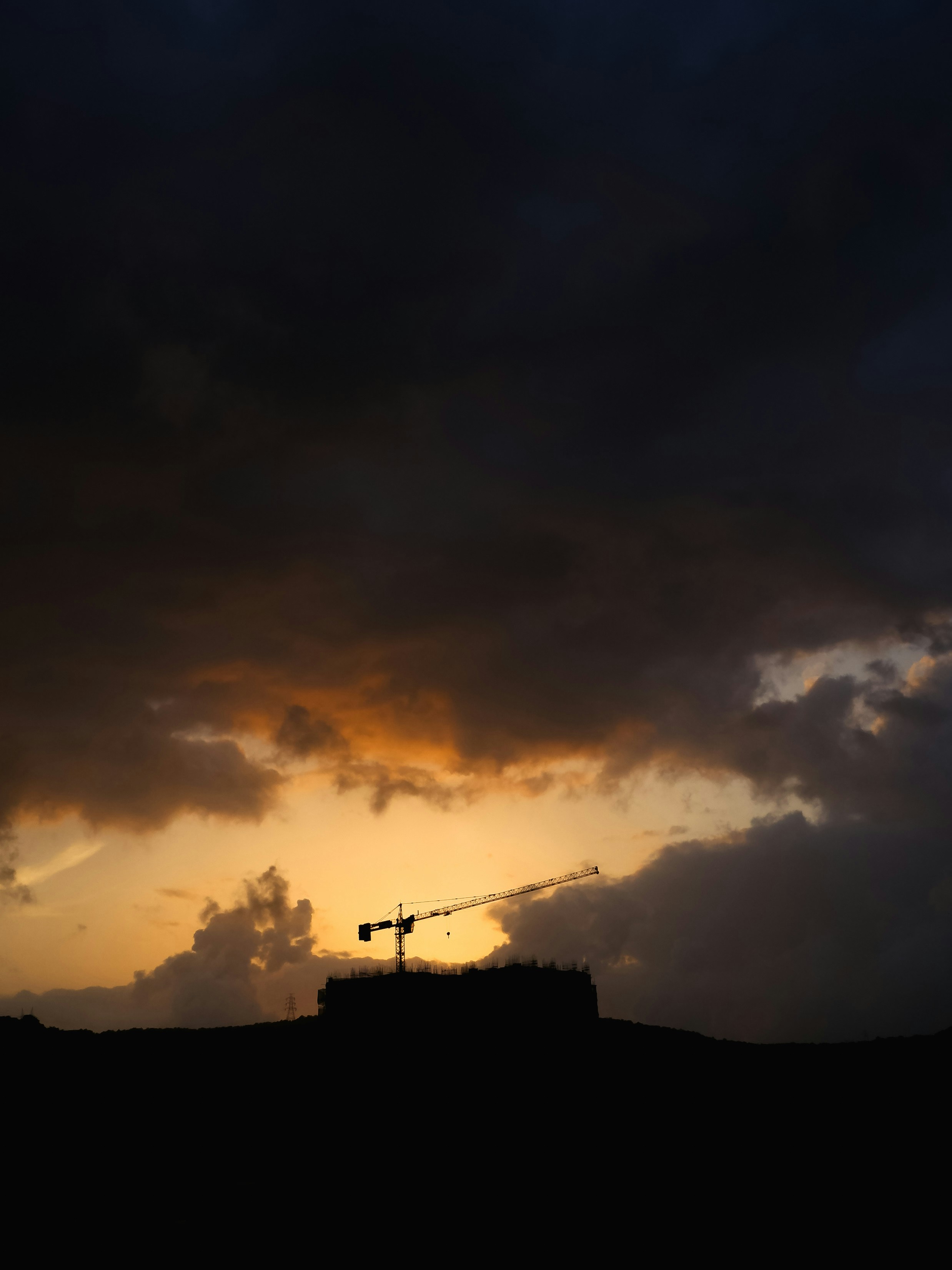 Crane Silhouette at Dusk: Skyfire Over a Silent Horizon