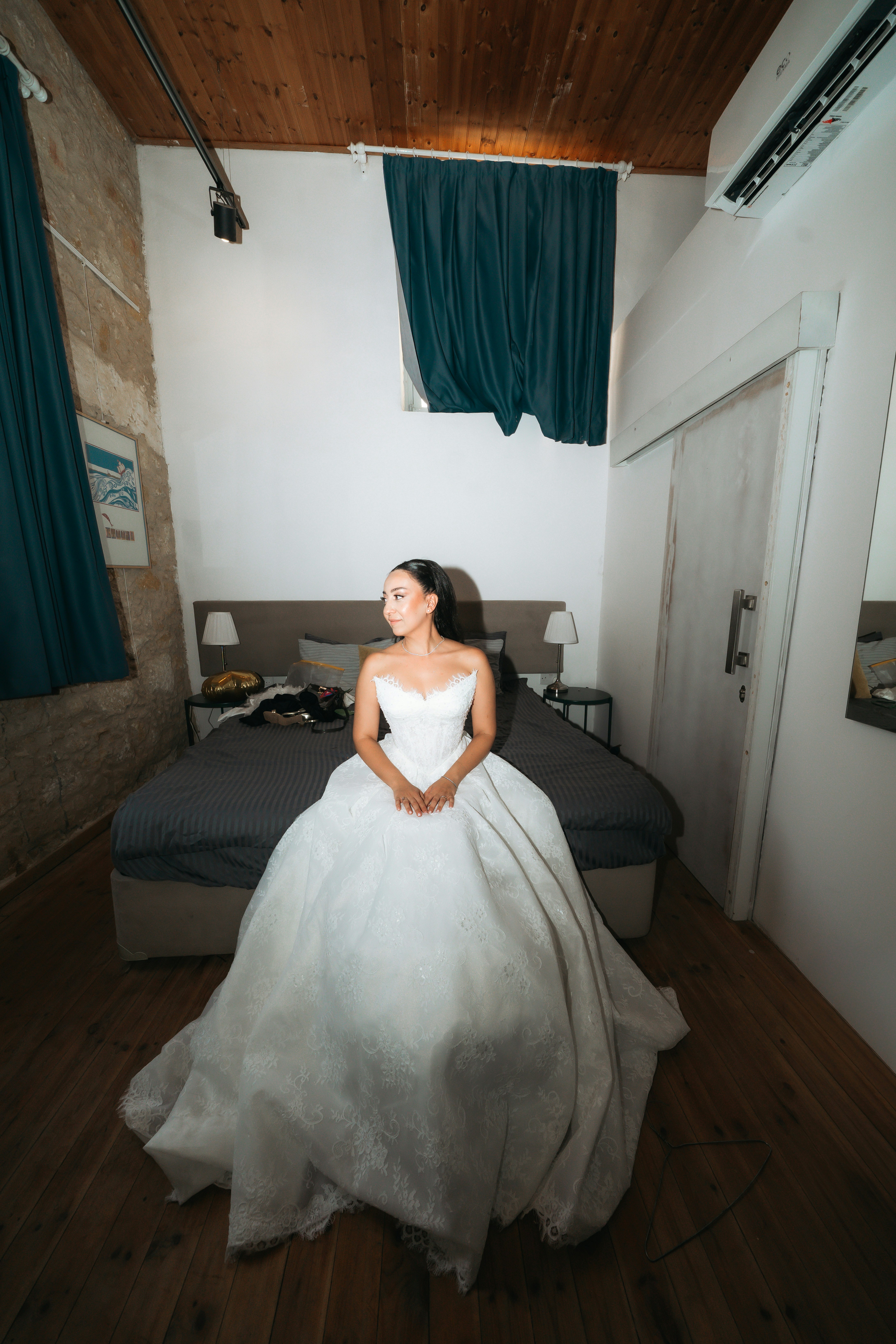 Bride in a Dimly Lit Loft: A Quiet Moment Before the Vows
