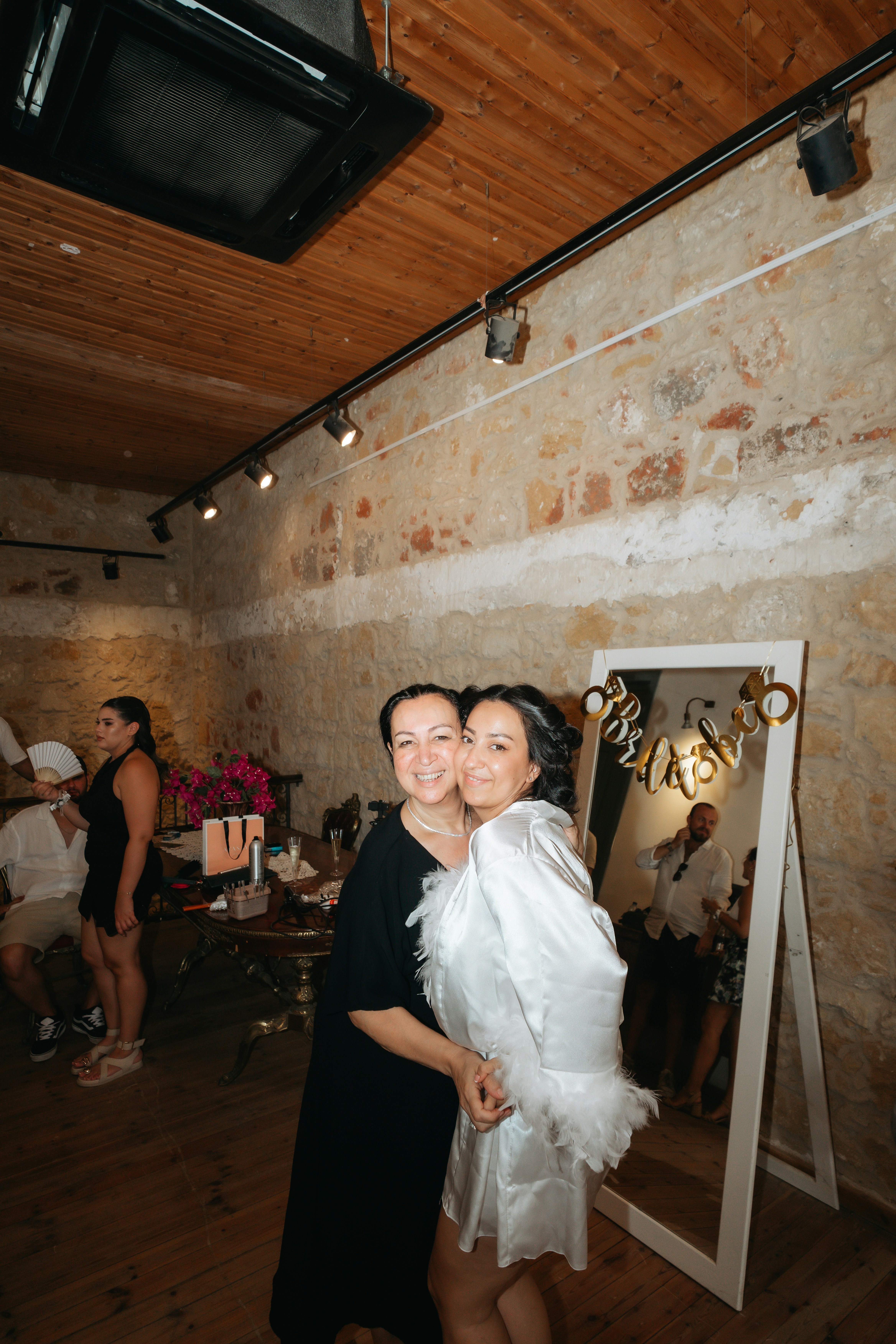 Two Friends Share a Moment at a Rustic Celebration