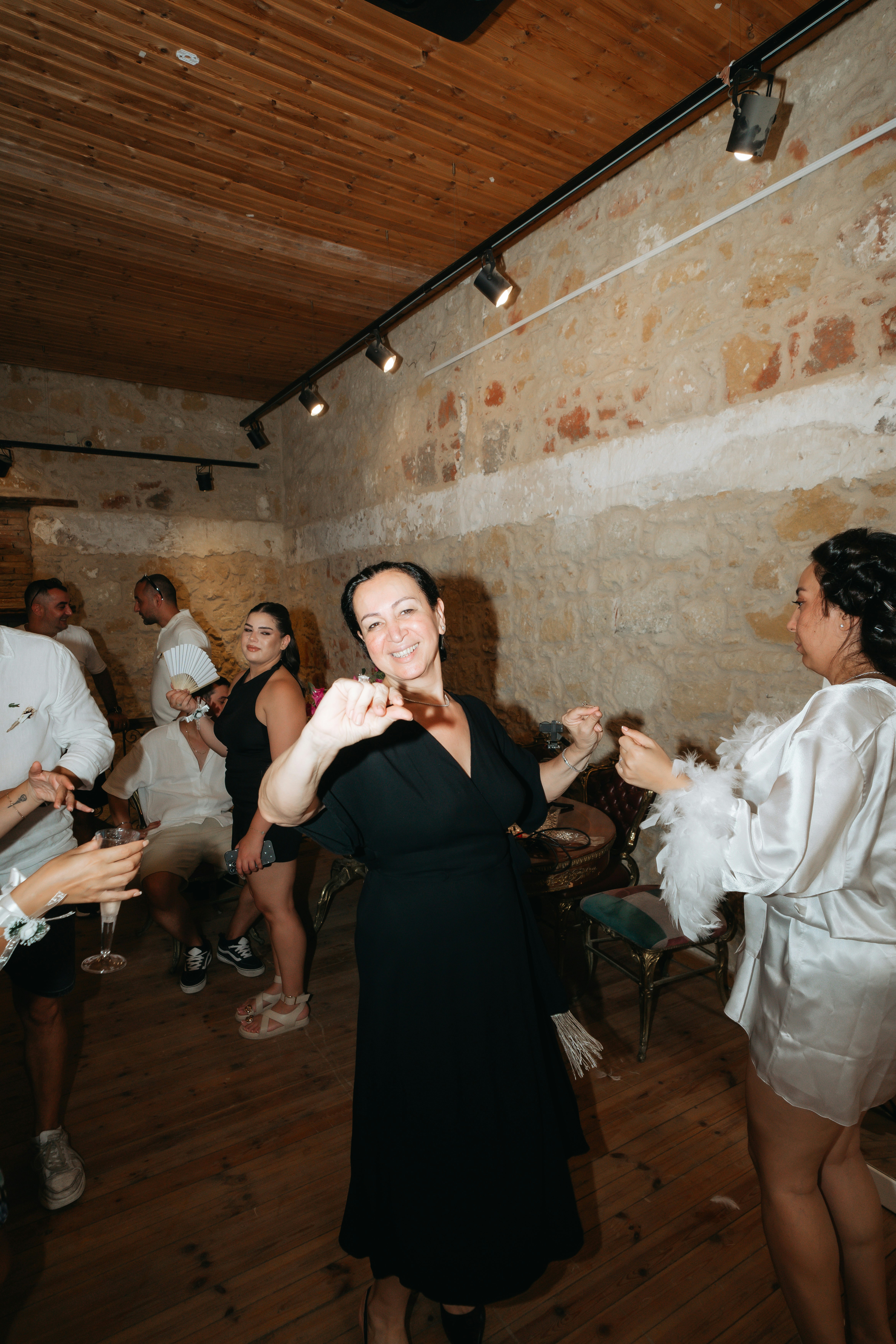 Mid-dance spotlight: a guest in black leads the room’s energy