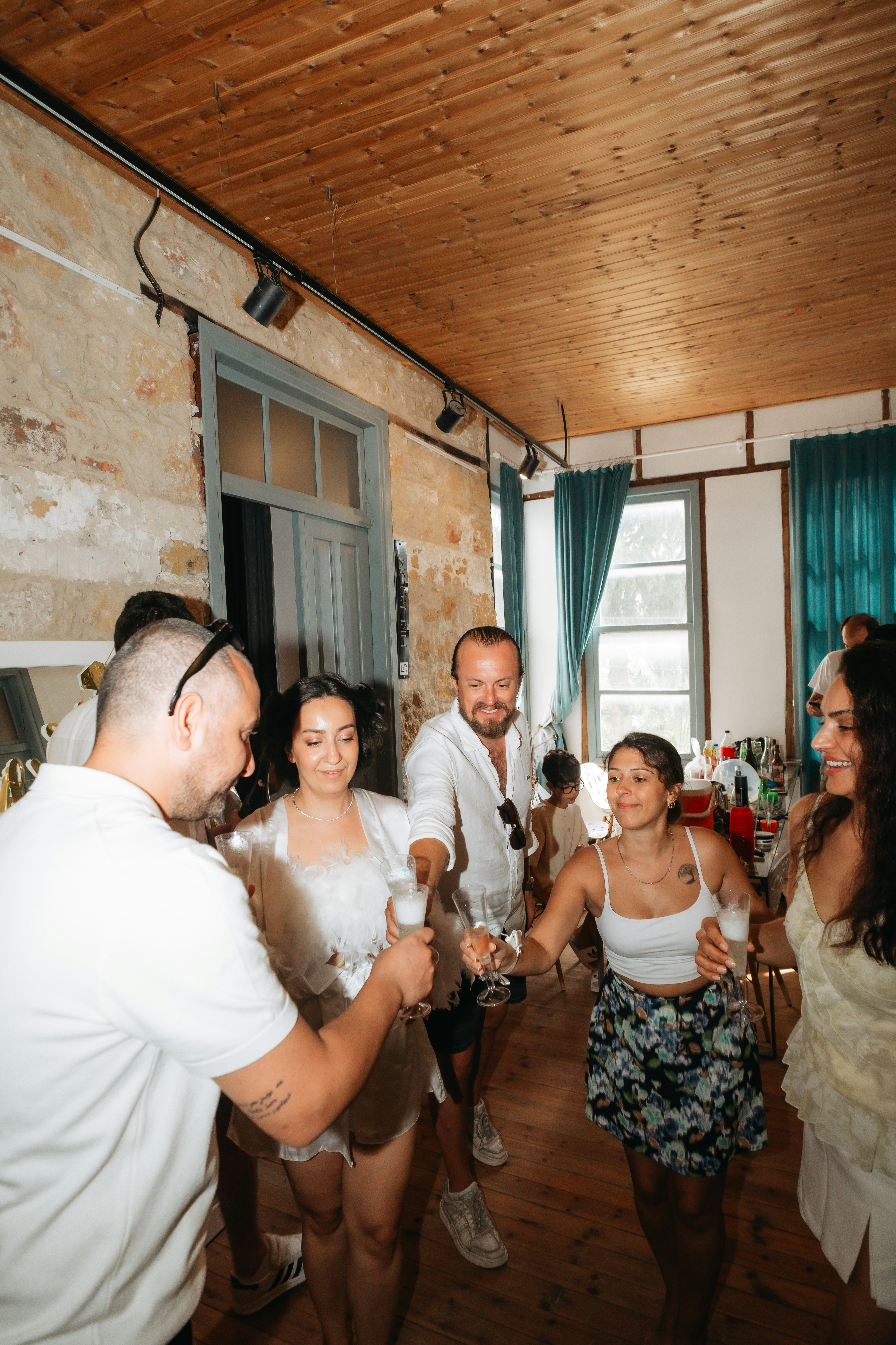 Toast in a sunlit room: cheers around the toasting circle