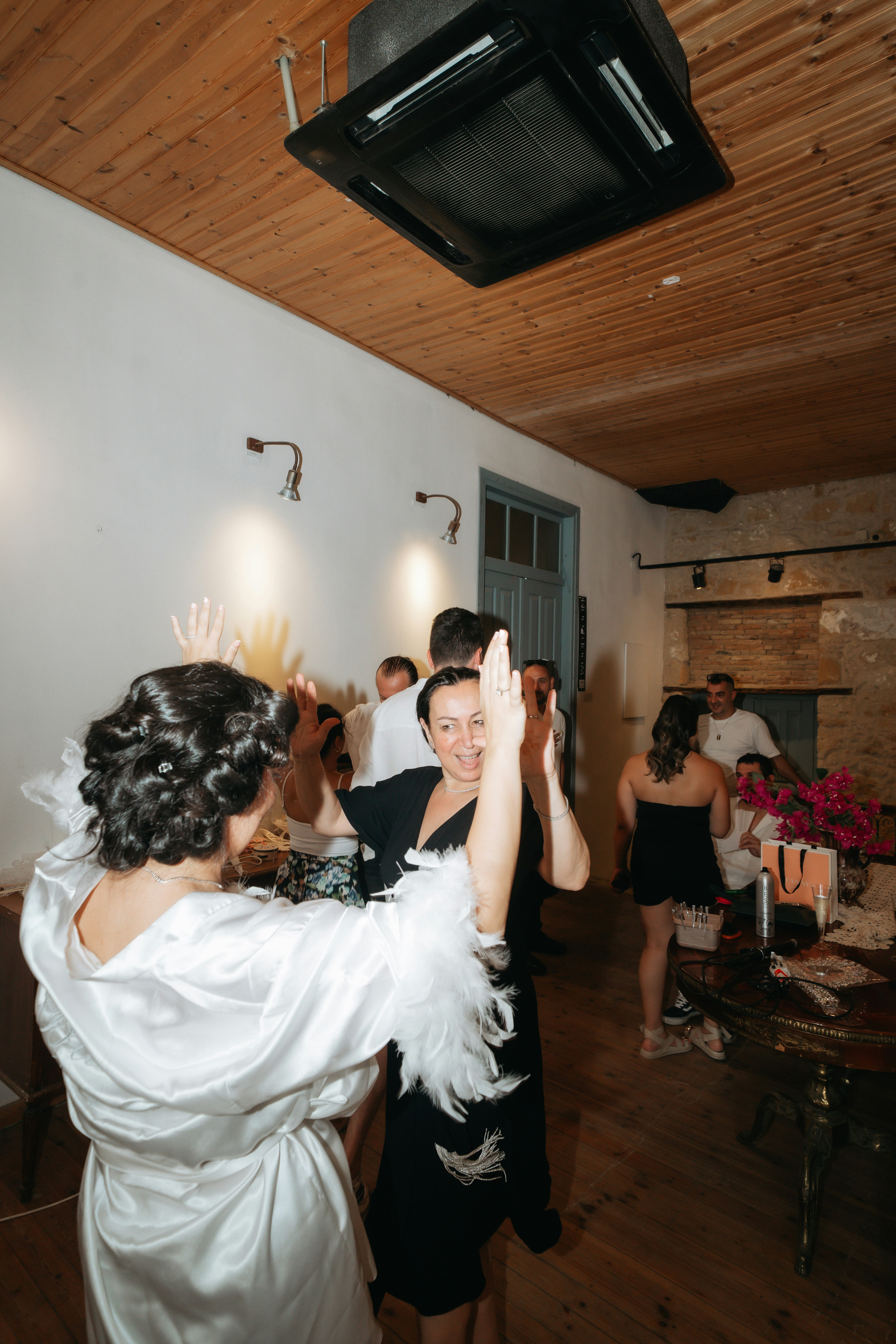 Celebration in a Cozy Loft: High-Fives and Shared Joy