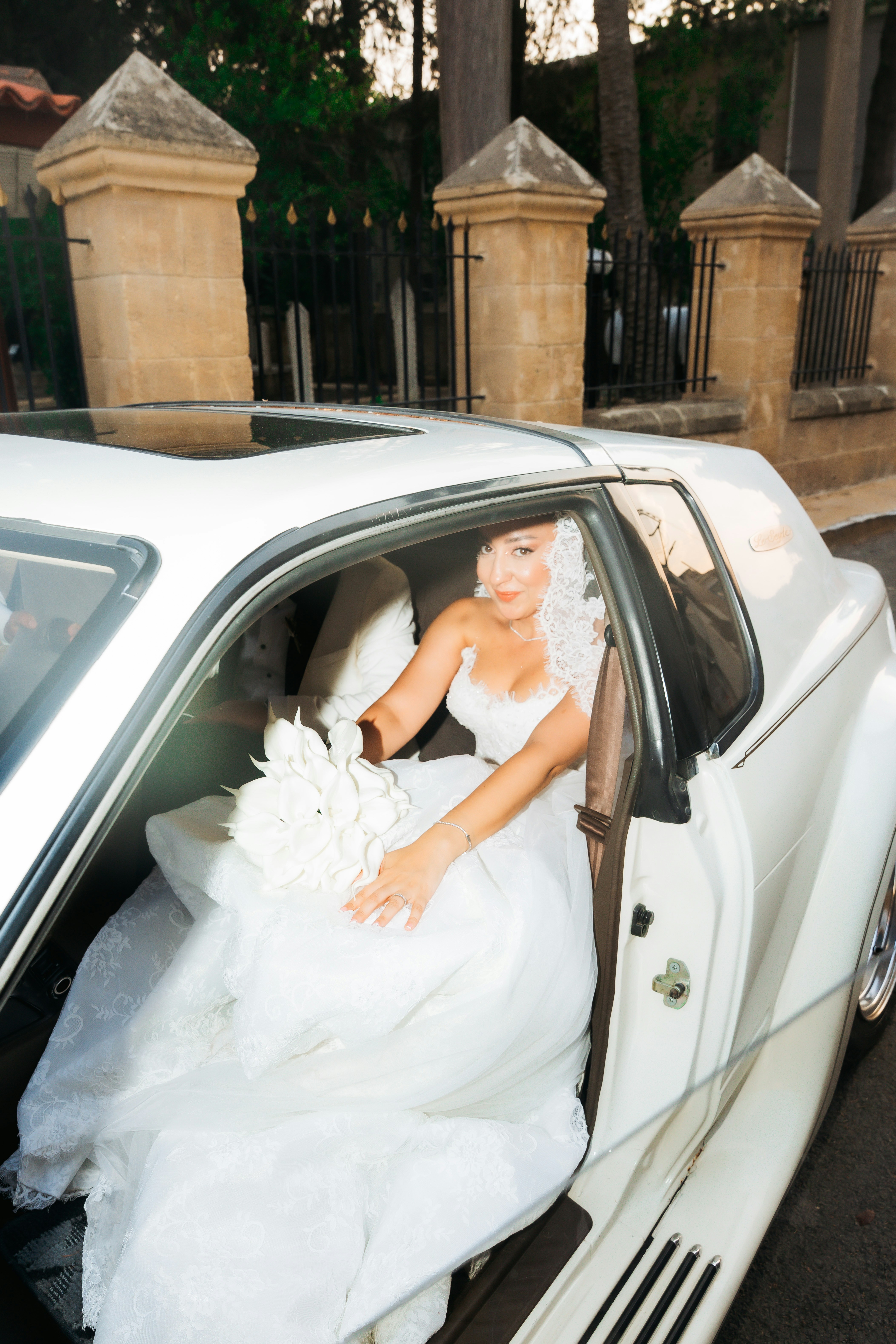 Bride Descends from a Vintage Car in Quiet Ceremony Moment