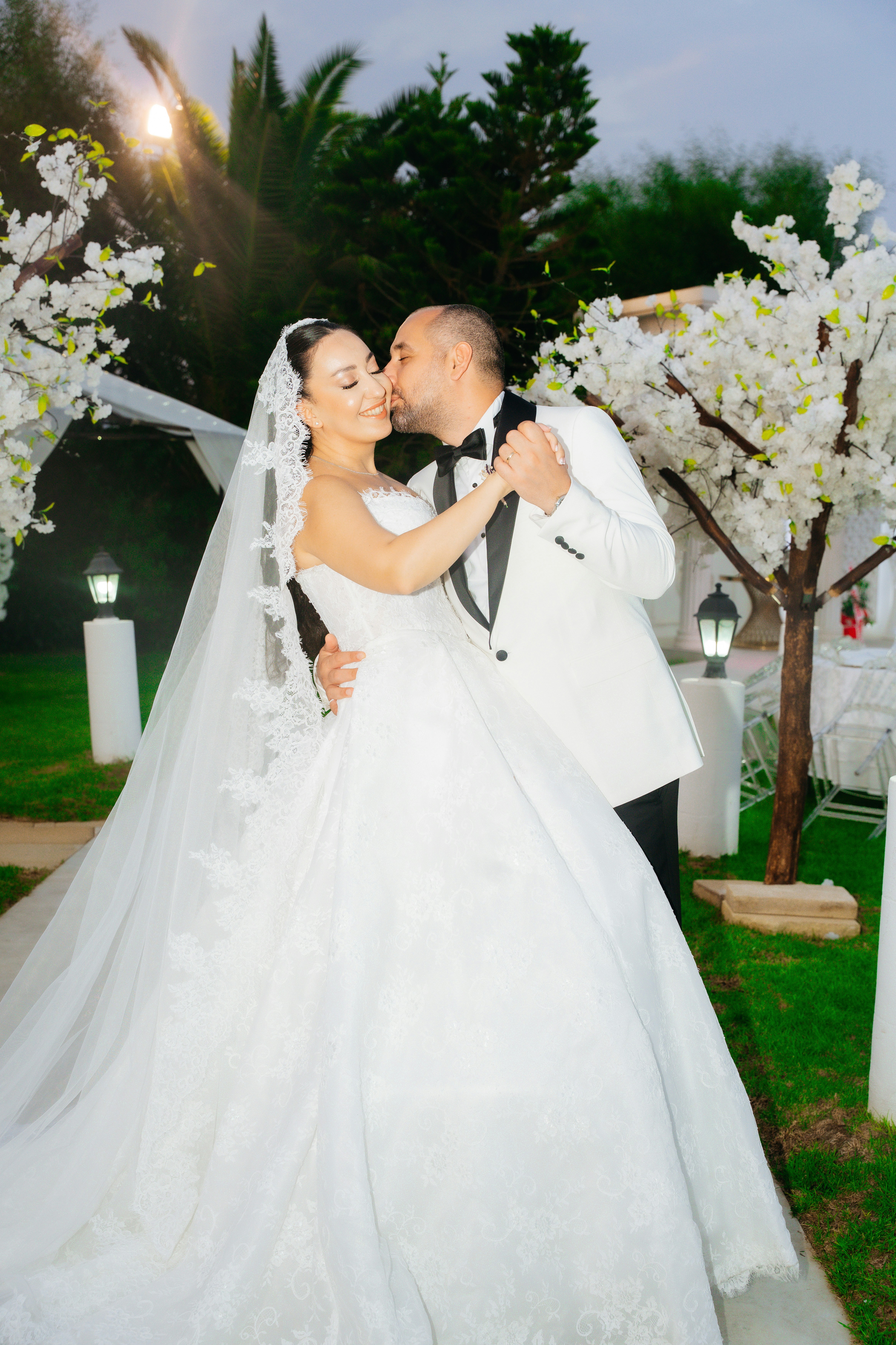Twirl of Love under blossom arch