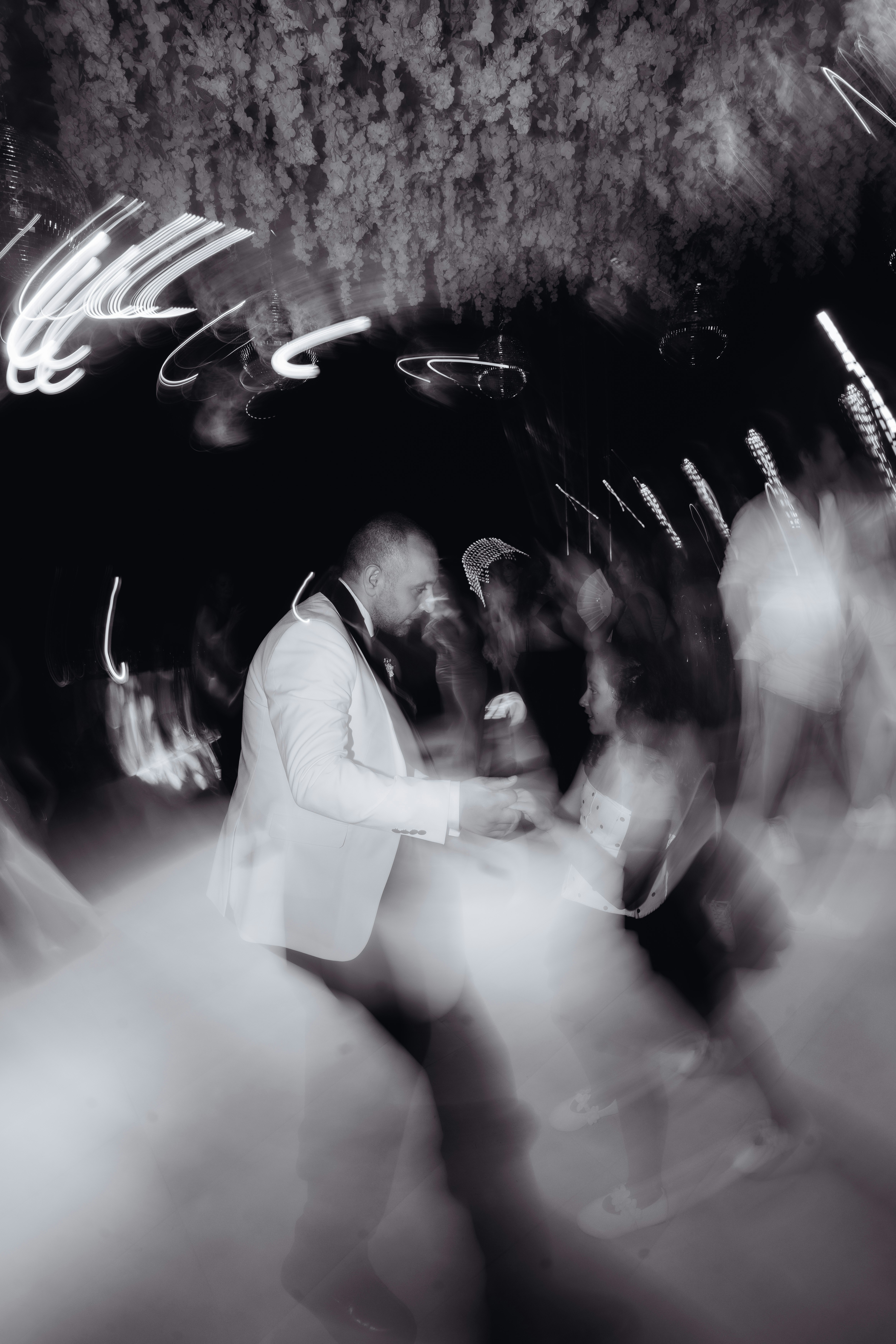 Dancing in the Dim Light: A Moment of White-Tie Motion