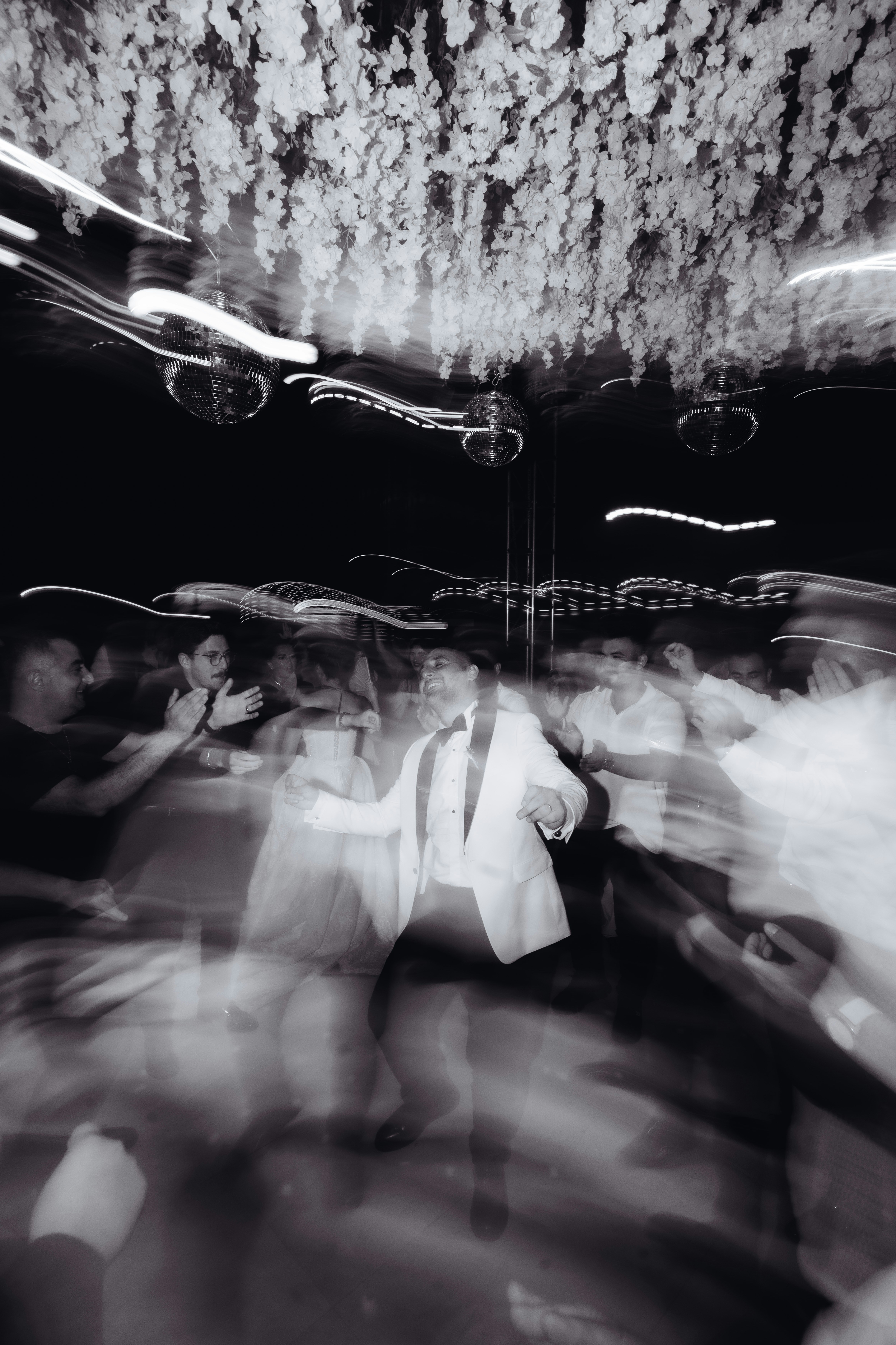 Midnight Waltz: A Blurred Celebration Captured in Motion
