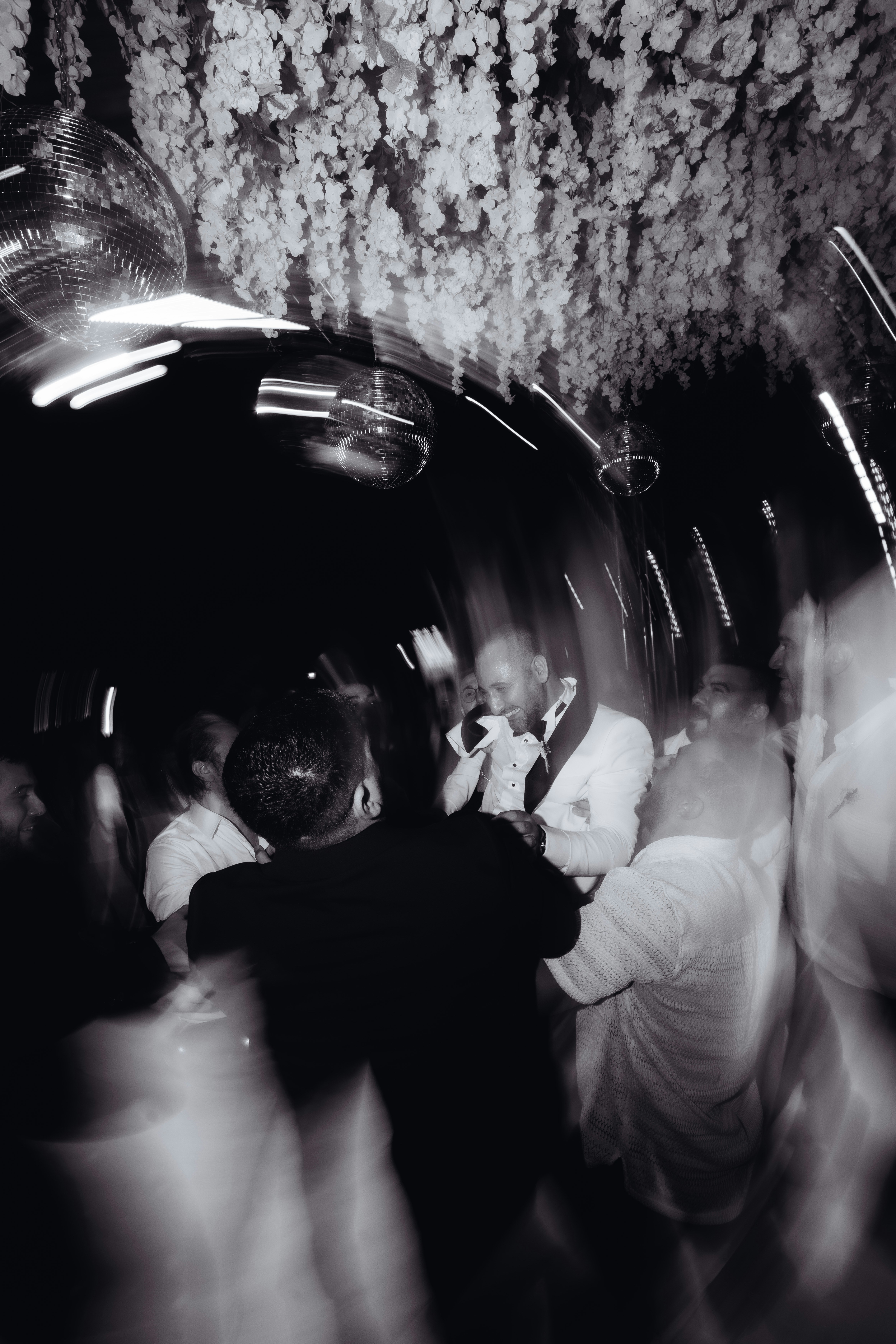 Midnight Orbit: A Ring of Dancers Encircling the Groom