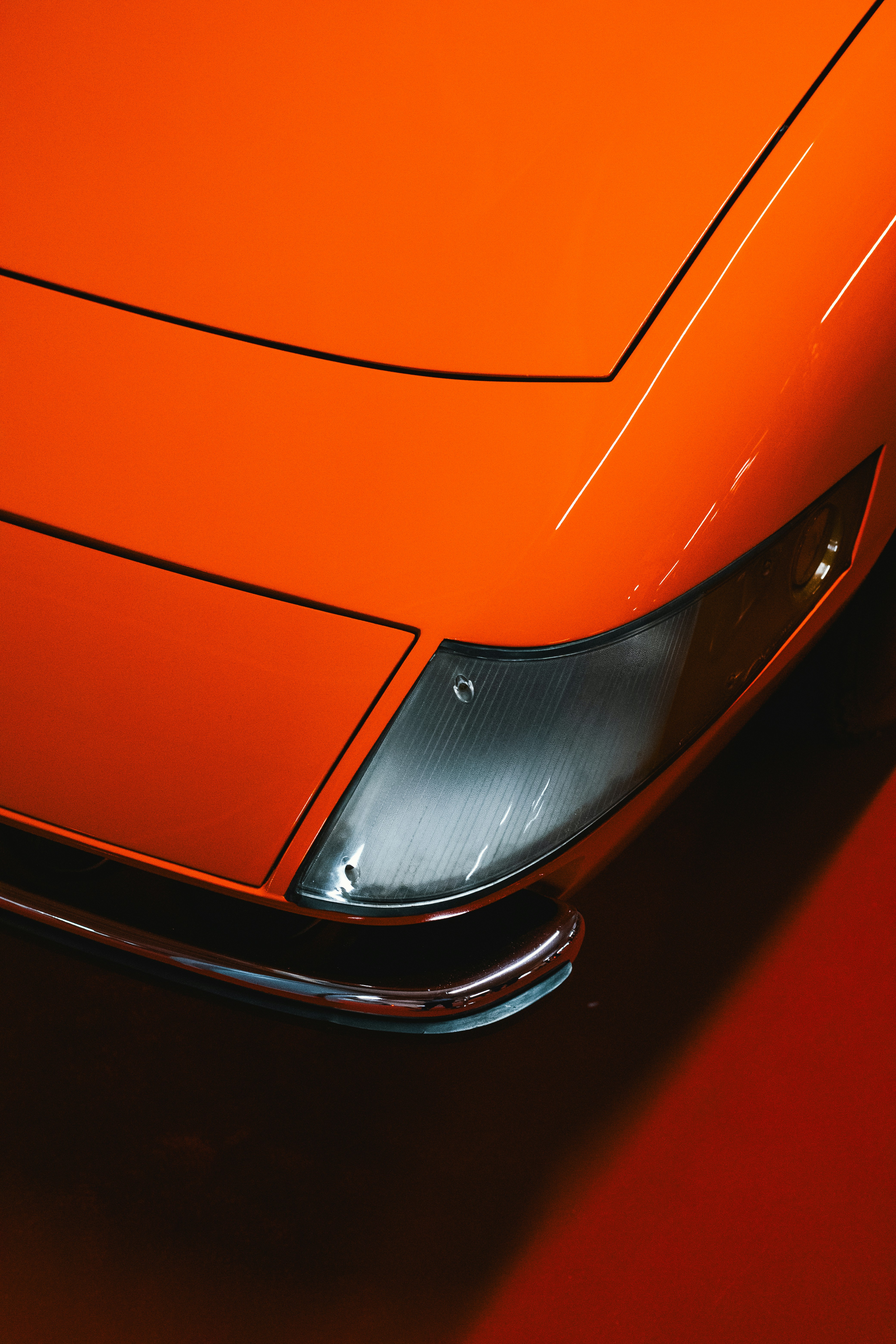 Vivid Orange: The Front Quarter of a Classic Sports Car
