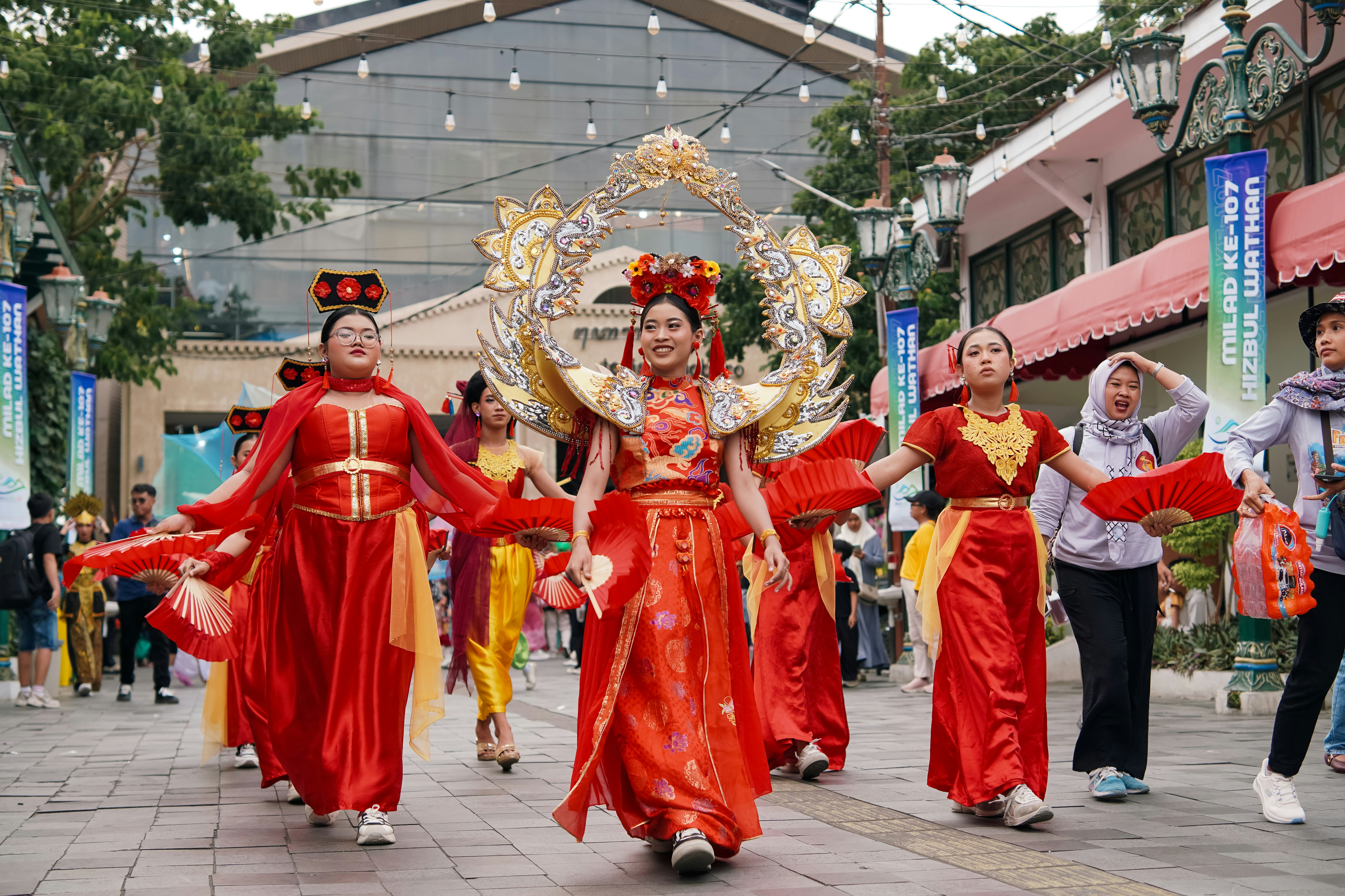 Red-Dawn Parade: Central Dancer Leads a Festival of Color