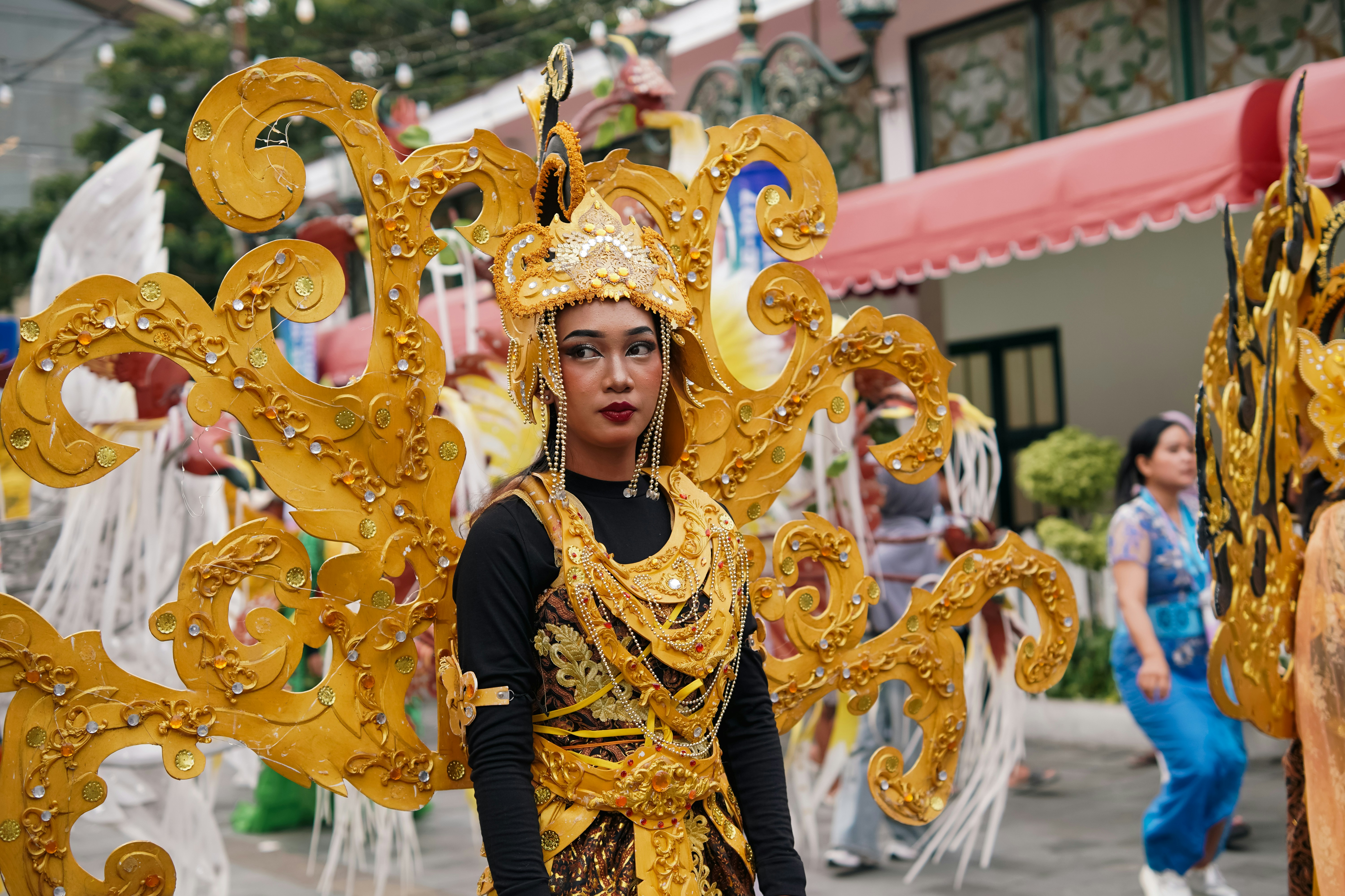 Golden Phoenix Dance—Intricate Headdress in a Festive Parade