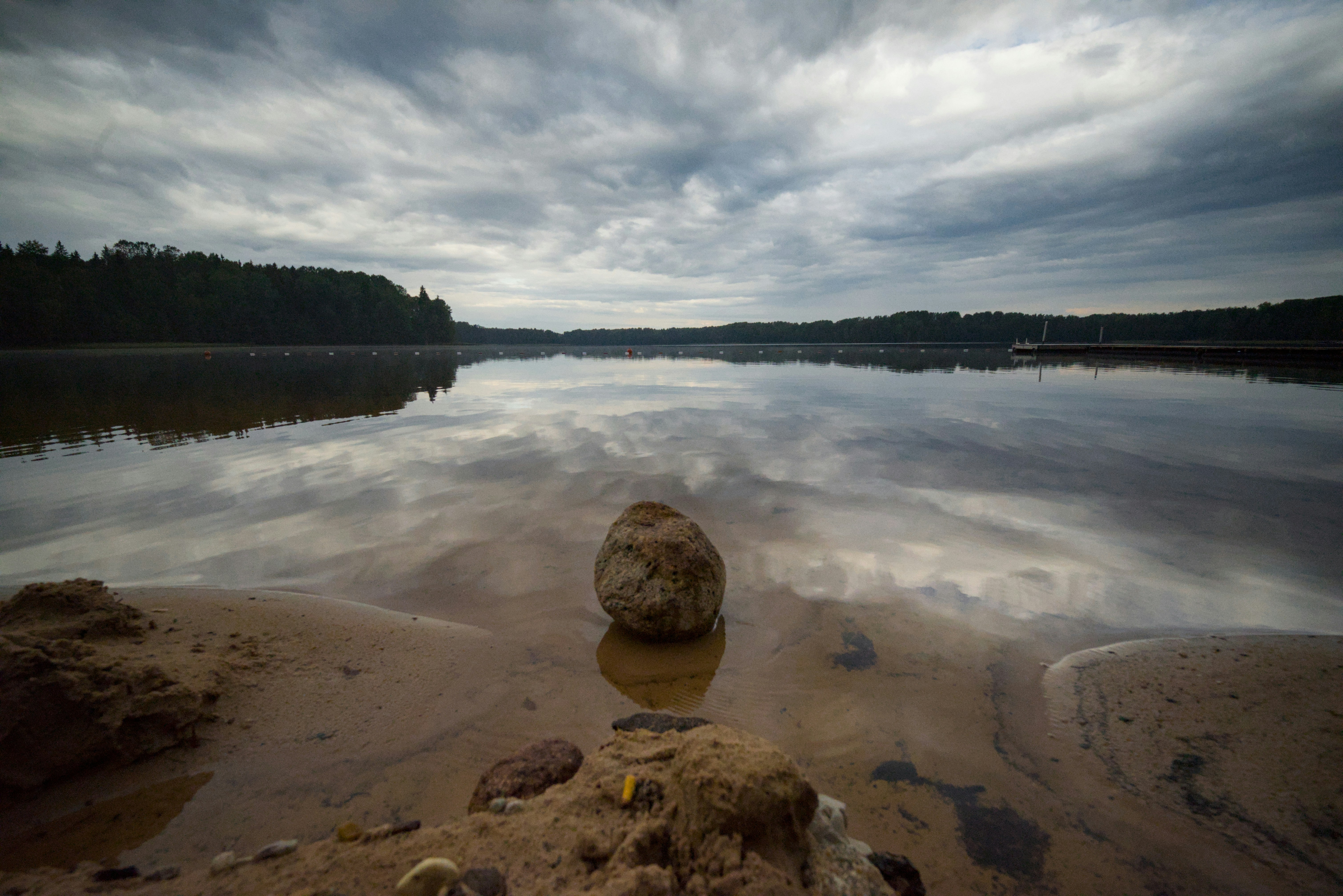 Centered Stone at the Calm Edge: A Quiet Lakeside Moment