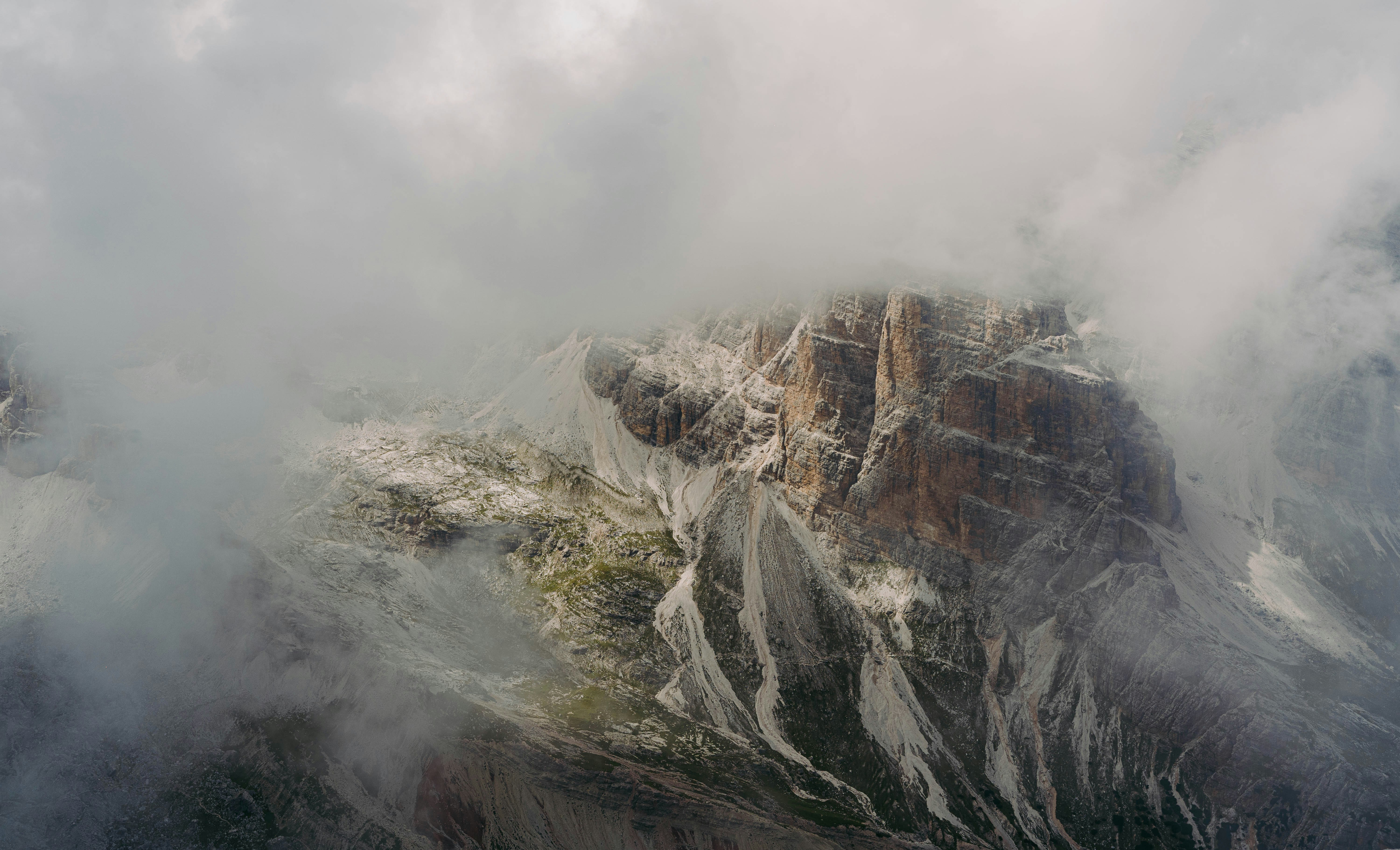 Mist-Clad Ridge Under An Alpine Veil