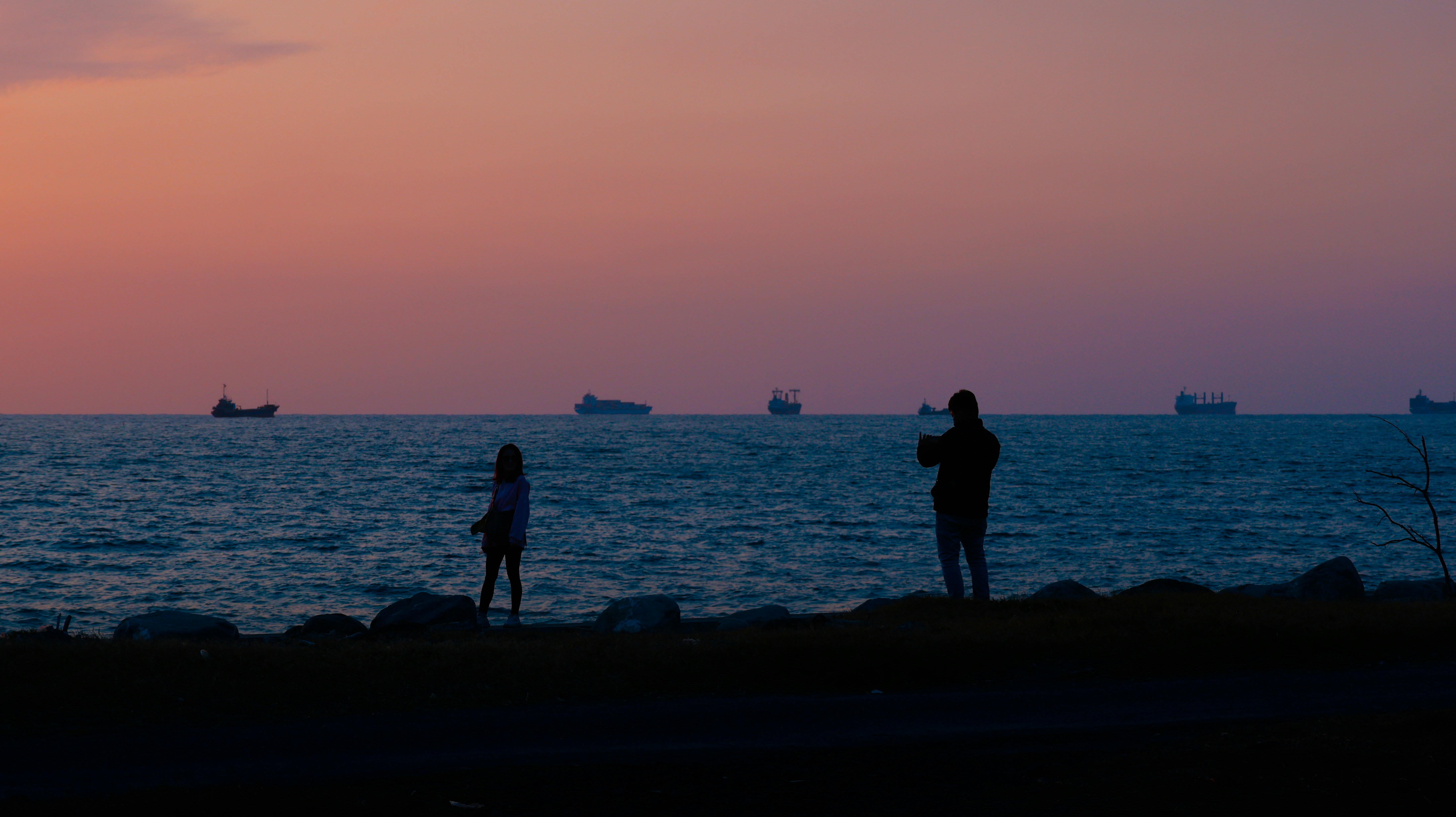 Silhouettes at Dusk: A Quiet Seaside Sketch