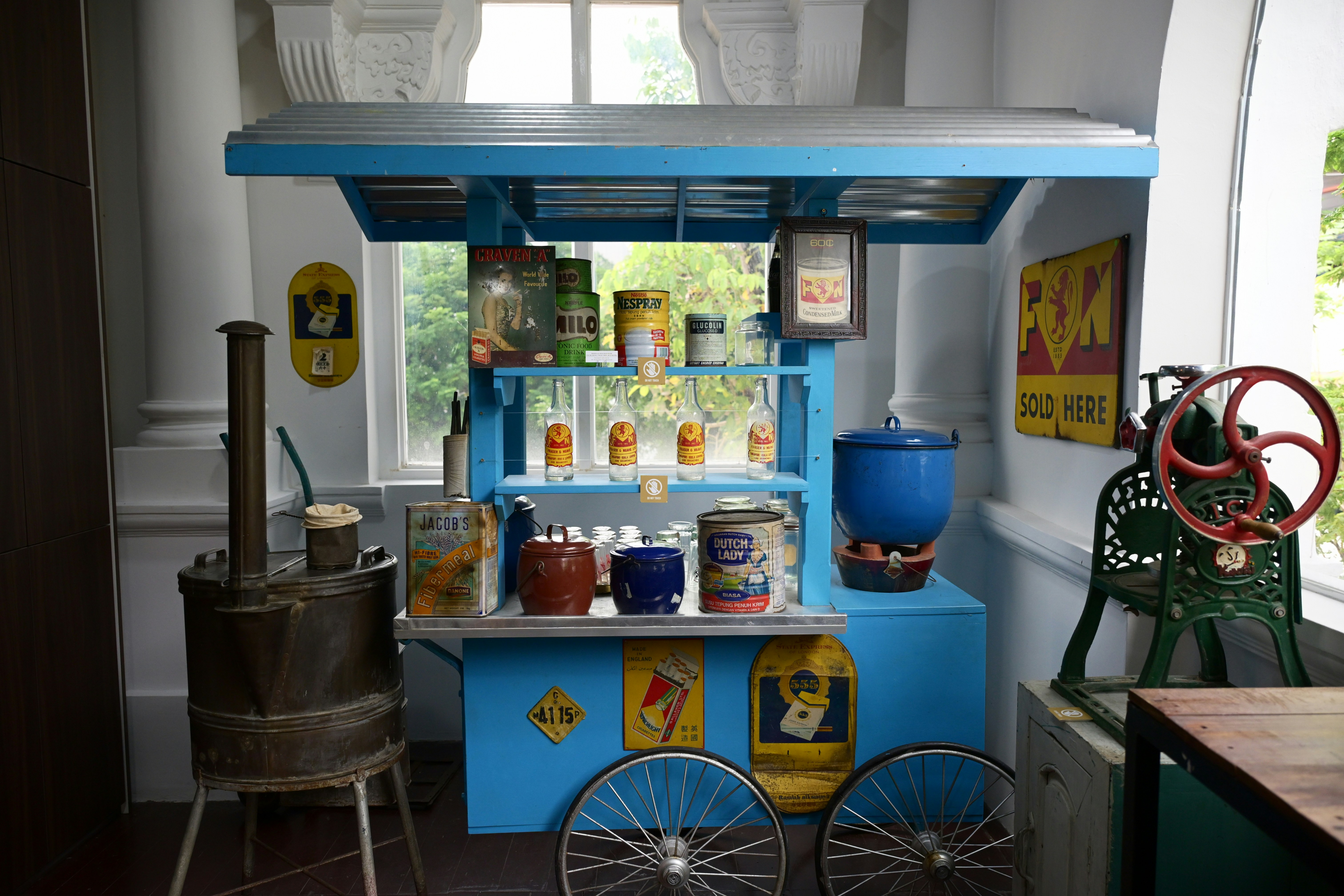 Blue Vendor Cart in a Quiet Indoor Nook