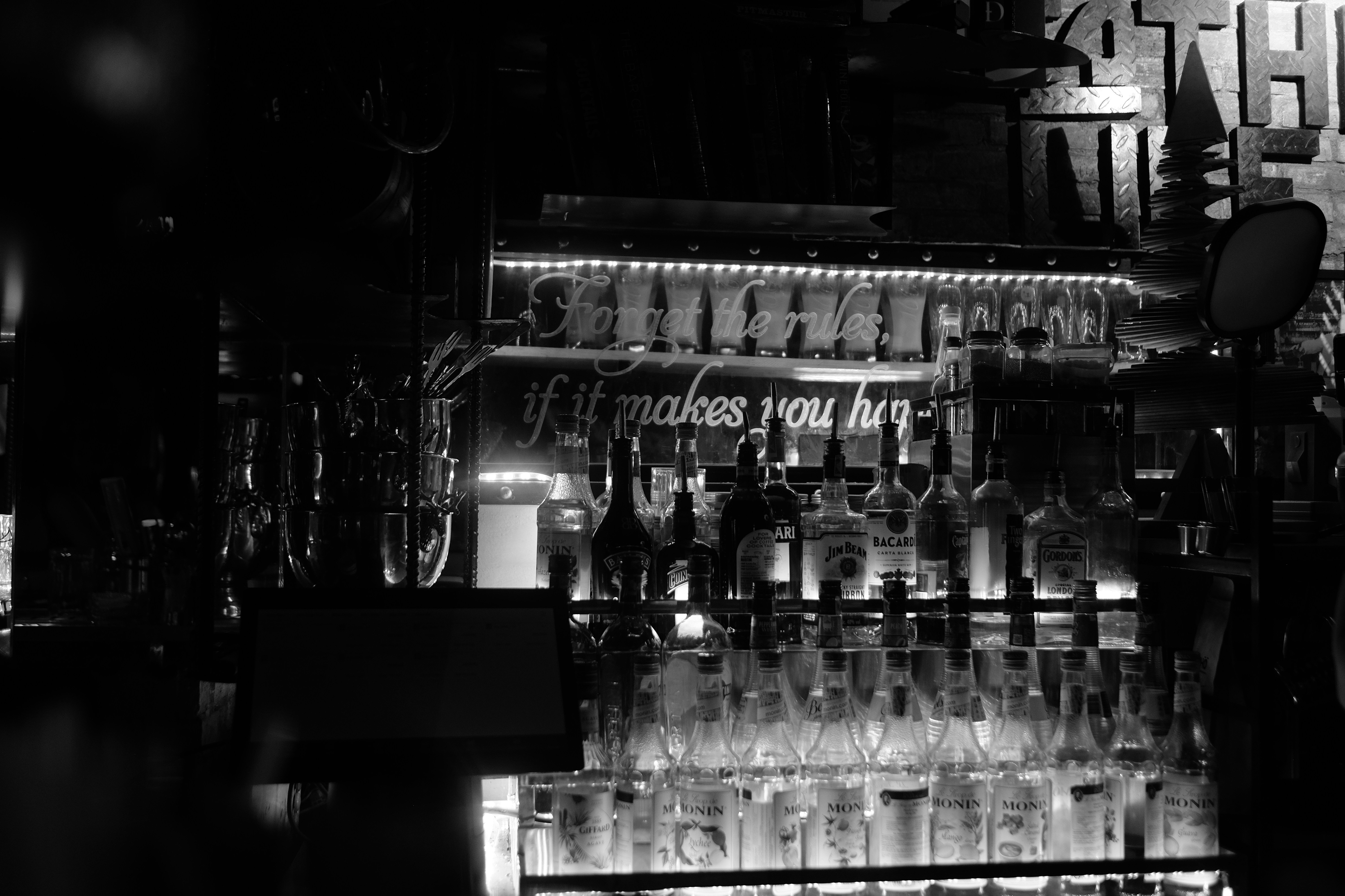 Neon Labyrinth: Bottles and Backlit Bar Night