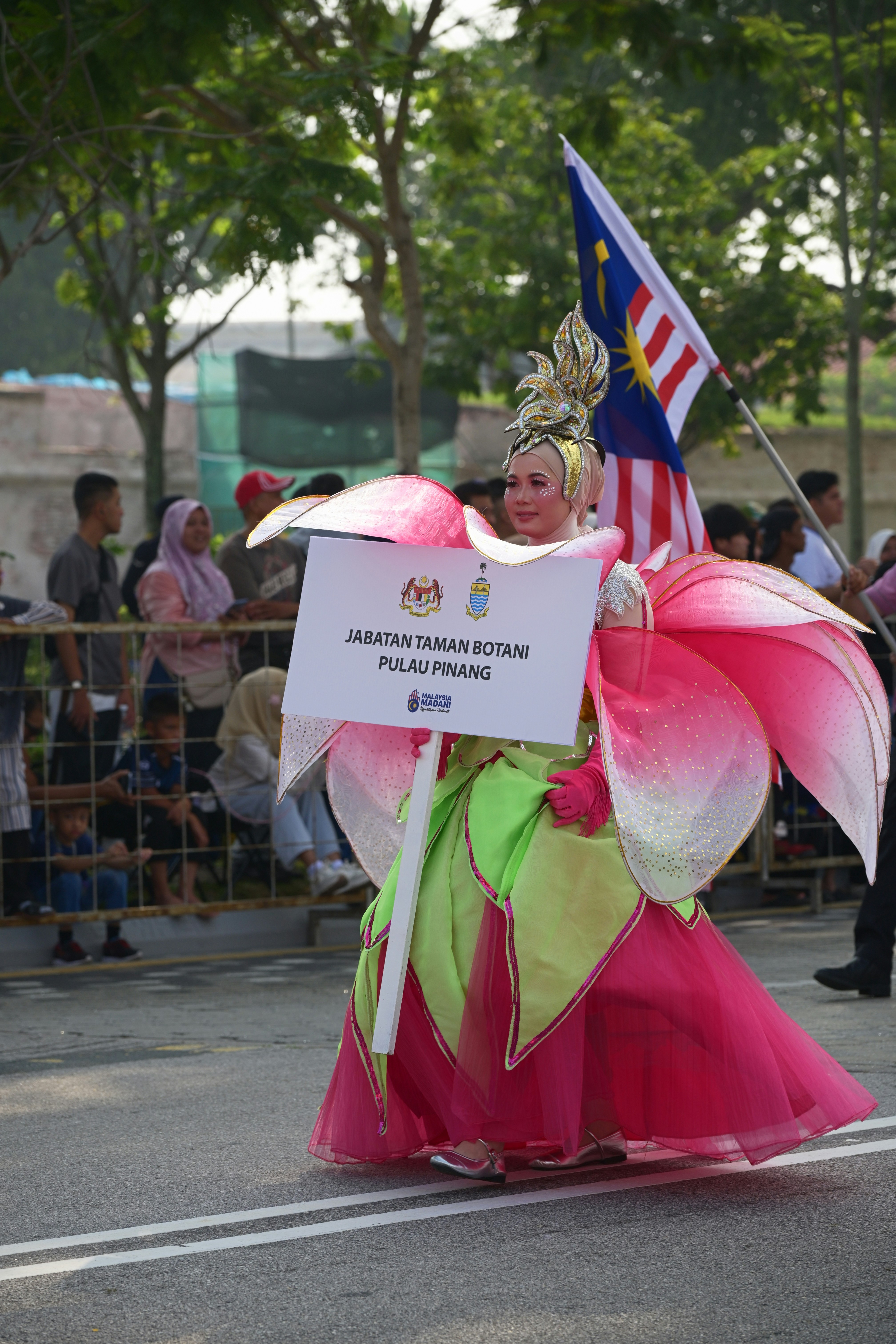 Floral Majesty on Parade: A Vibrant Costume Leads the Way