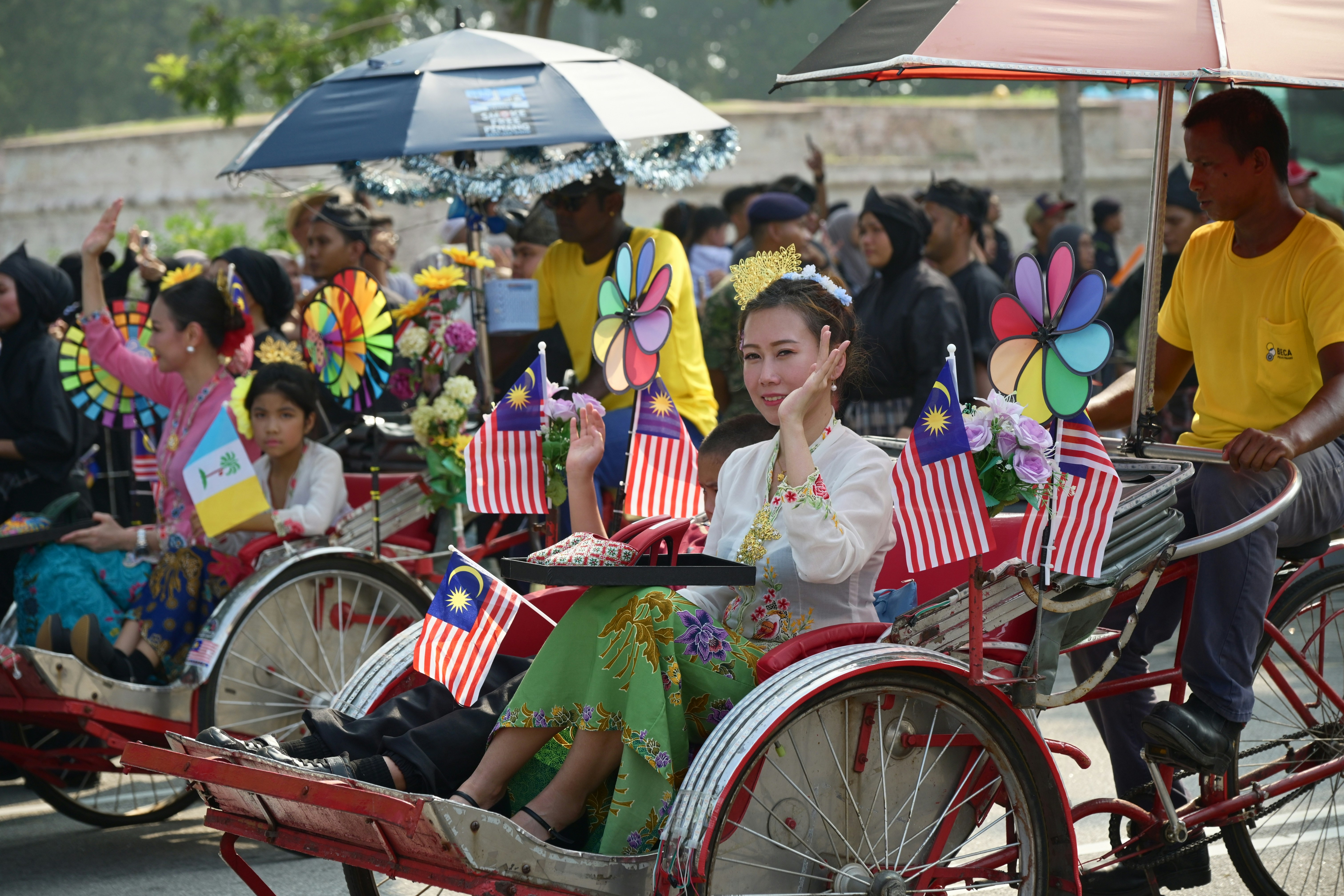 Girl in a Flower-Lined Cart: A Parade of Color and Flags