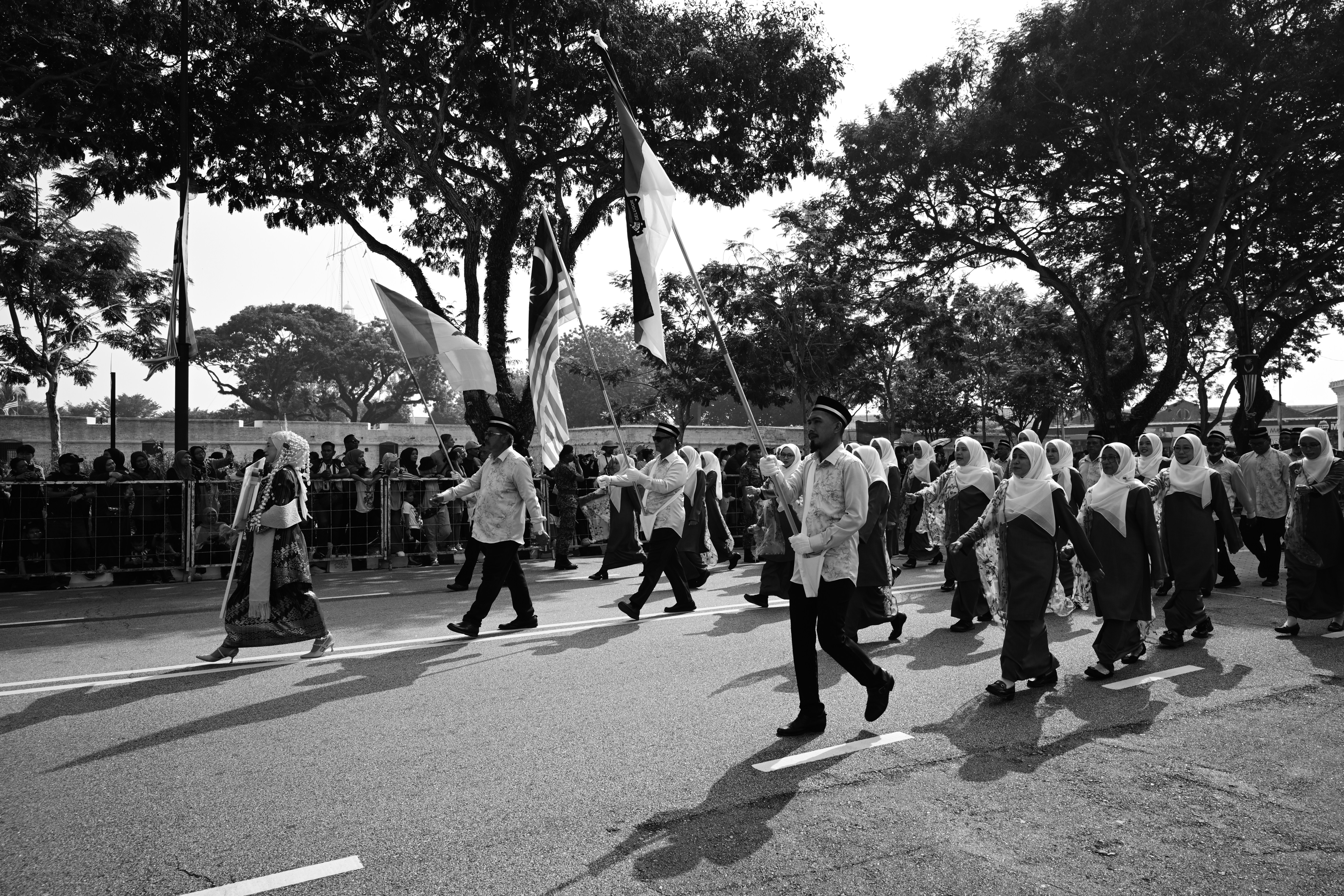 Marching Toward the Flag: A Quiet Parade in Black and White