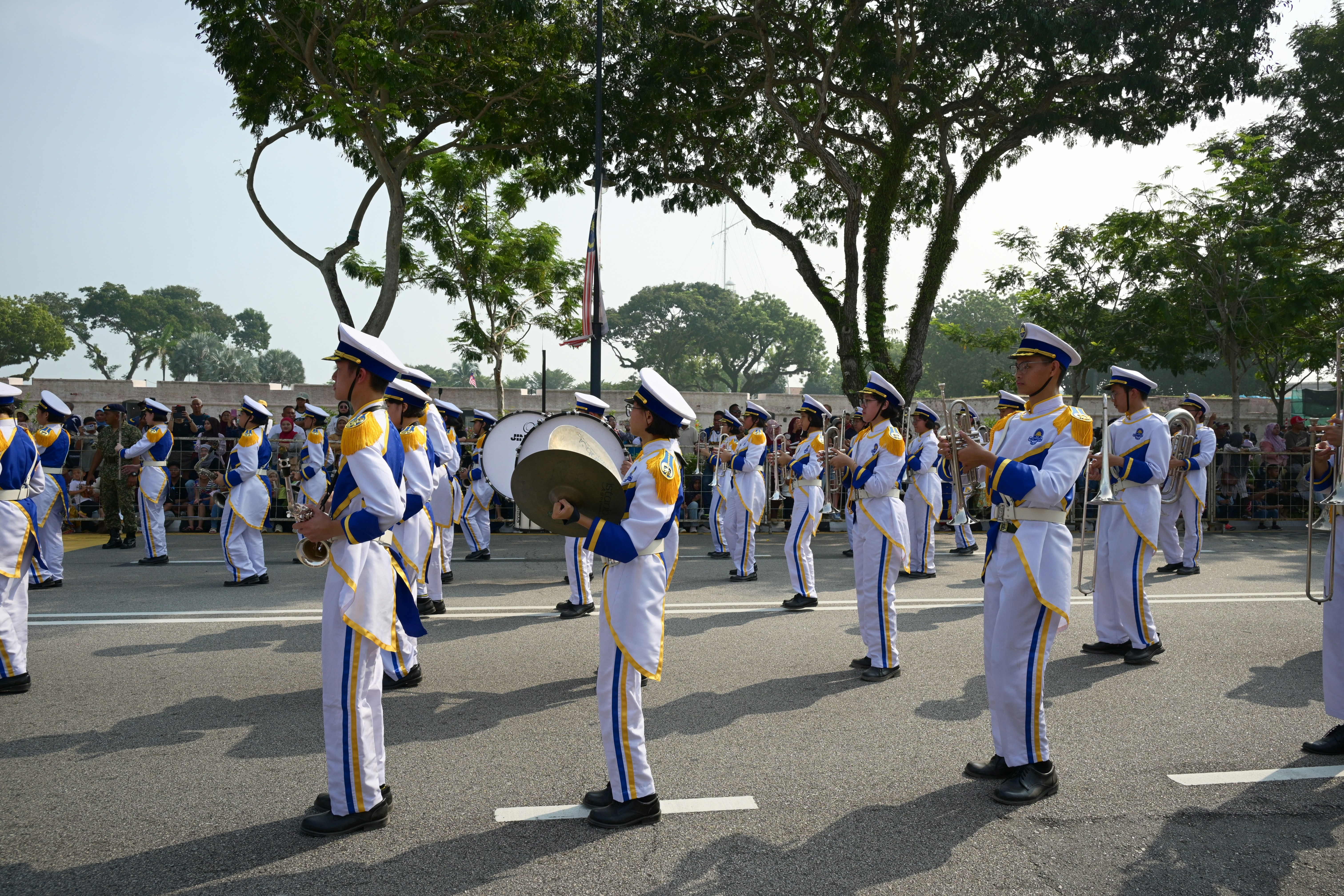 Marching Band in Formation under Dappled Sunlight