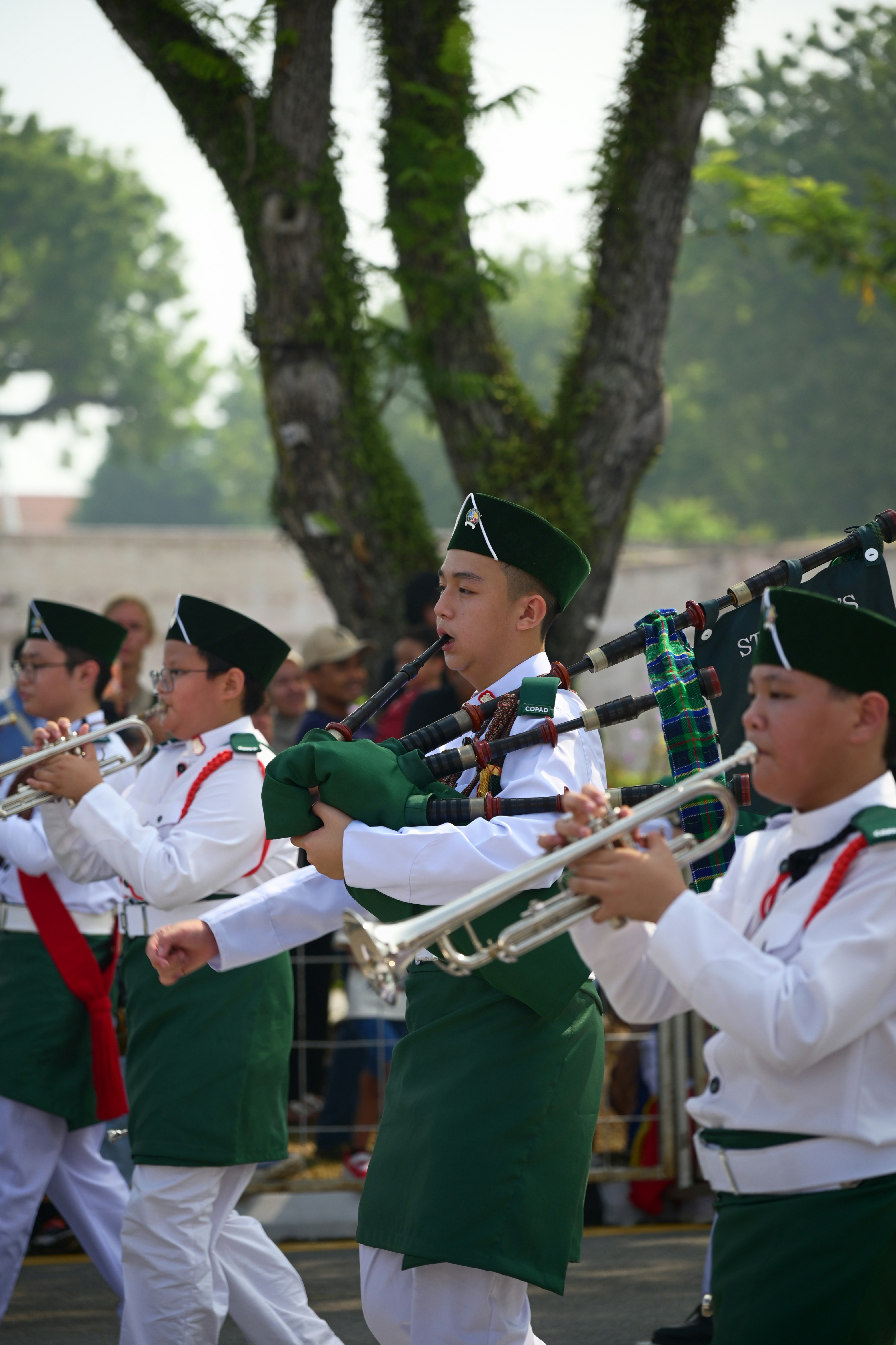 Marching Melodies: The Green-Hatted Trumpeters in Sync