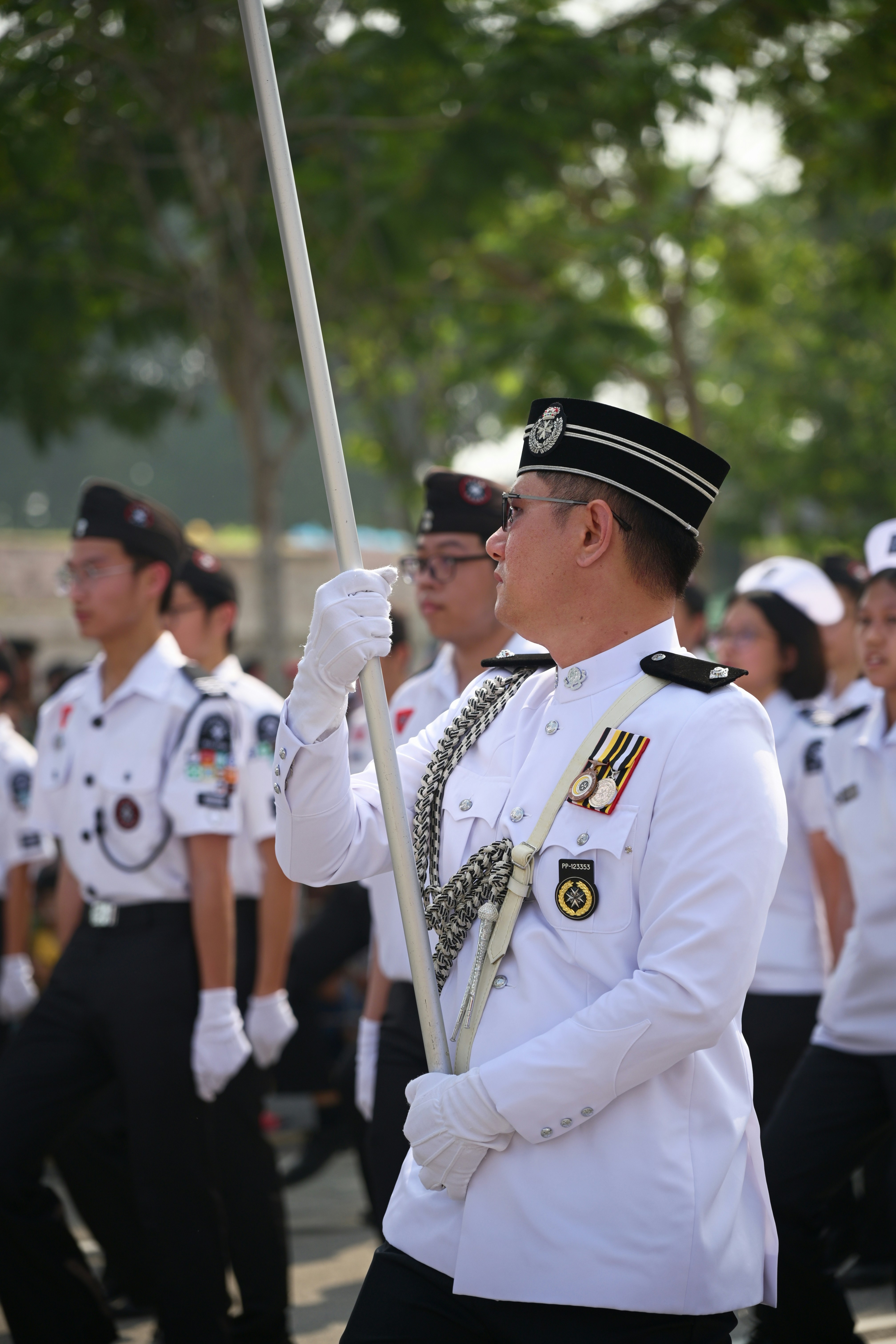 Colonel in White: Parade Salute Under Stringent Light