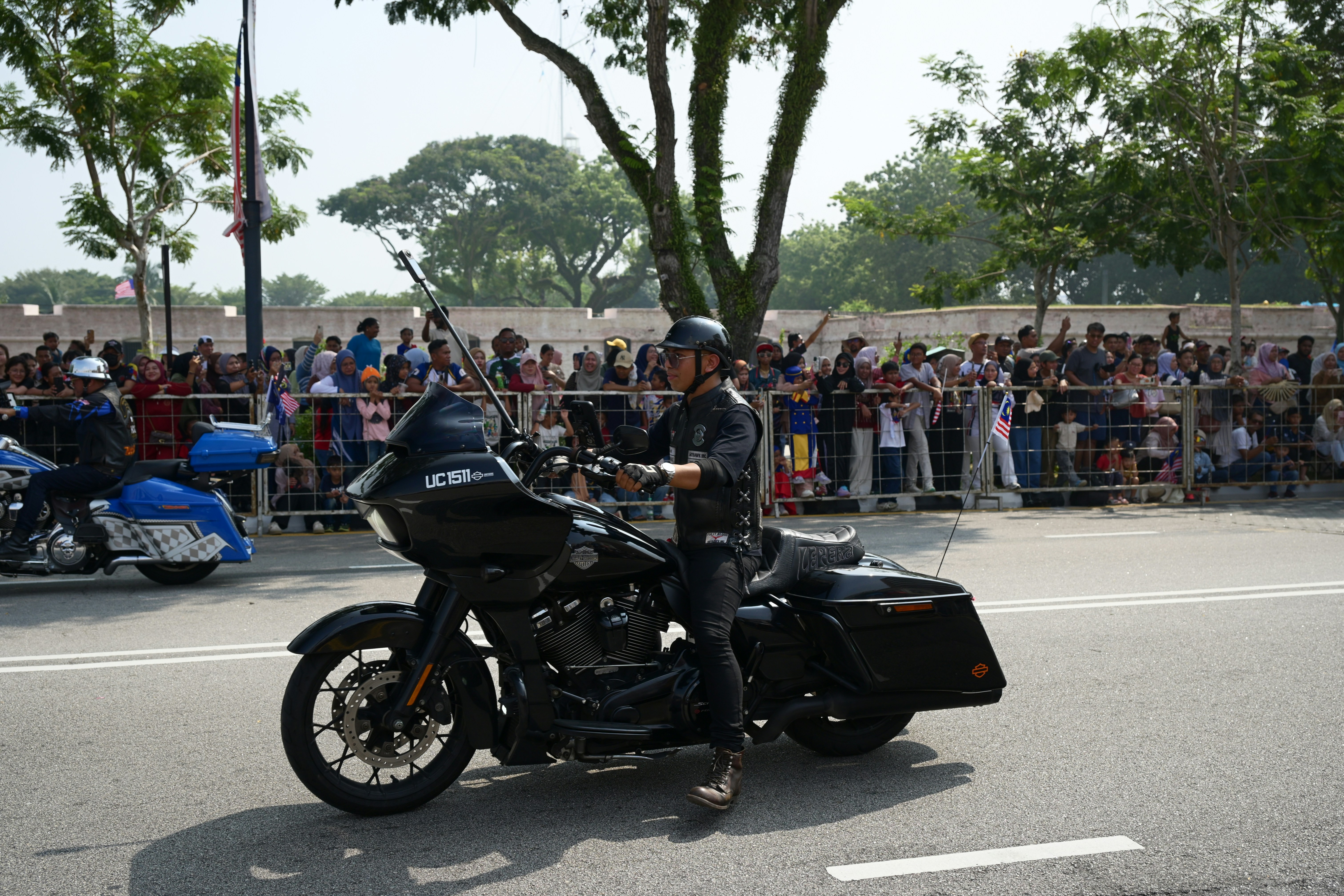 Rider and motorcycle parade: chrome and crowd in motion