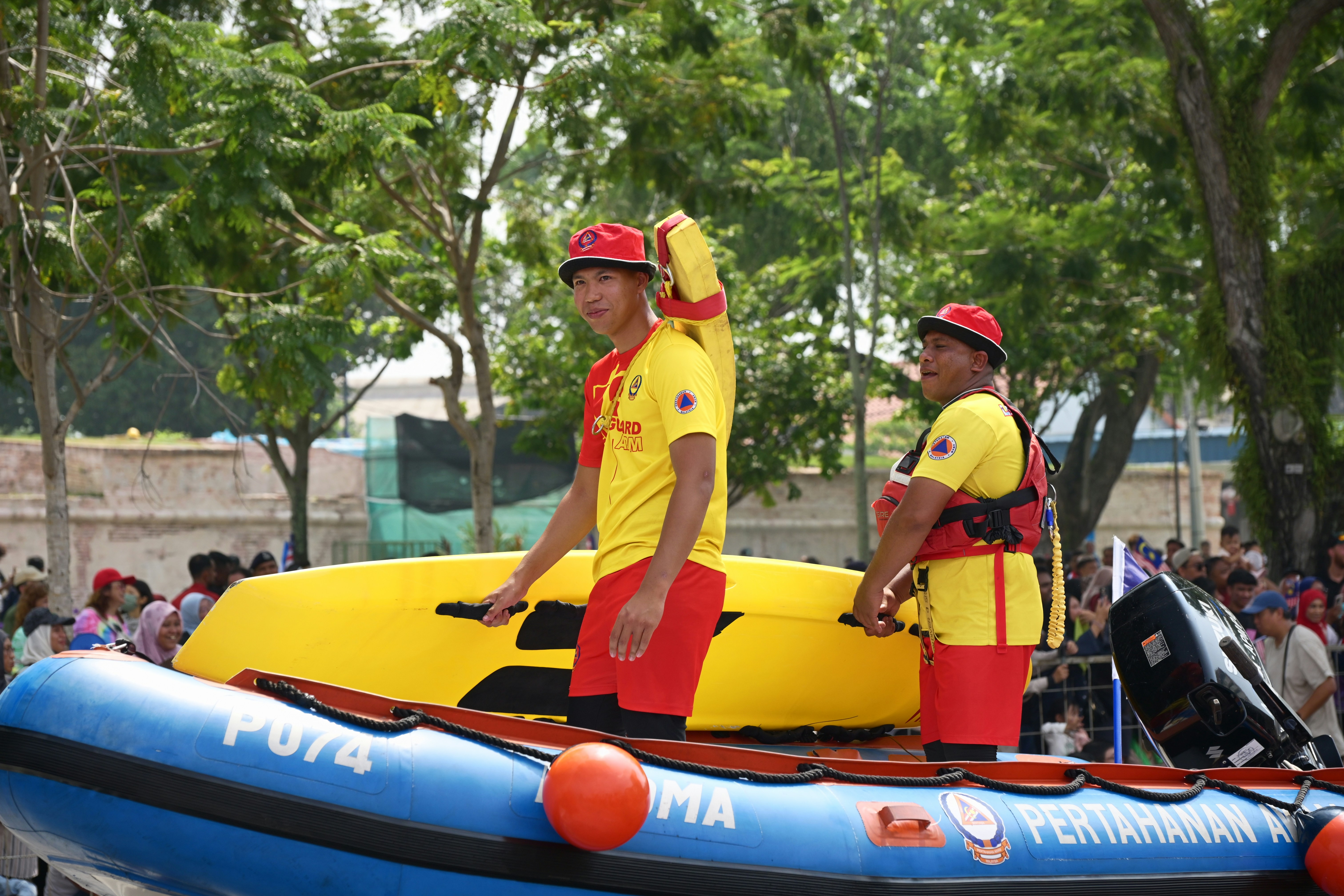 Rescue Crew on a Bright Inflatable Boat, Ready for Action