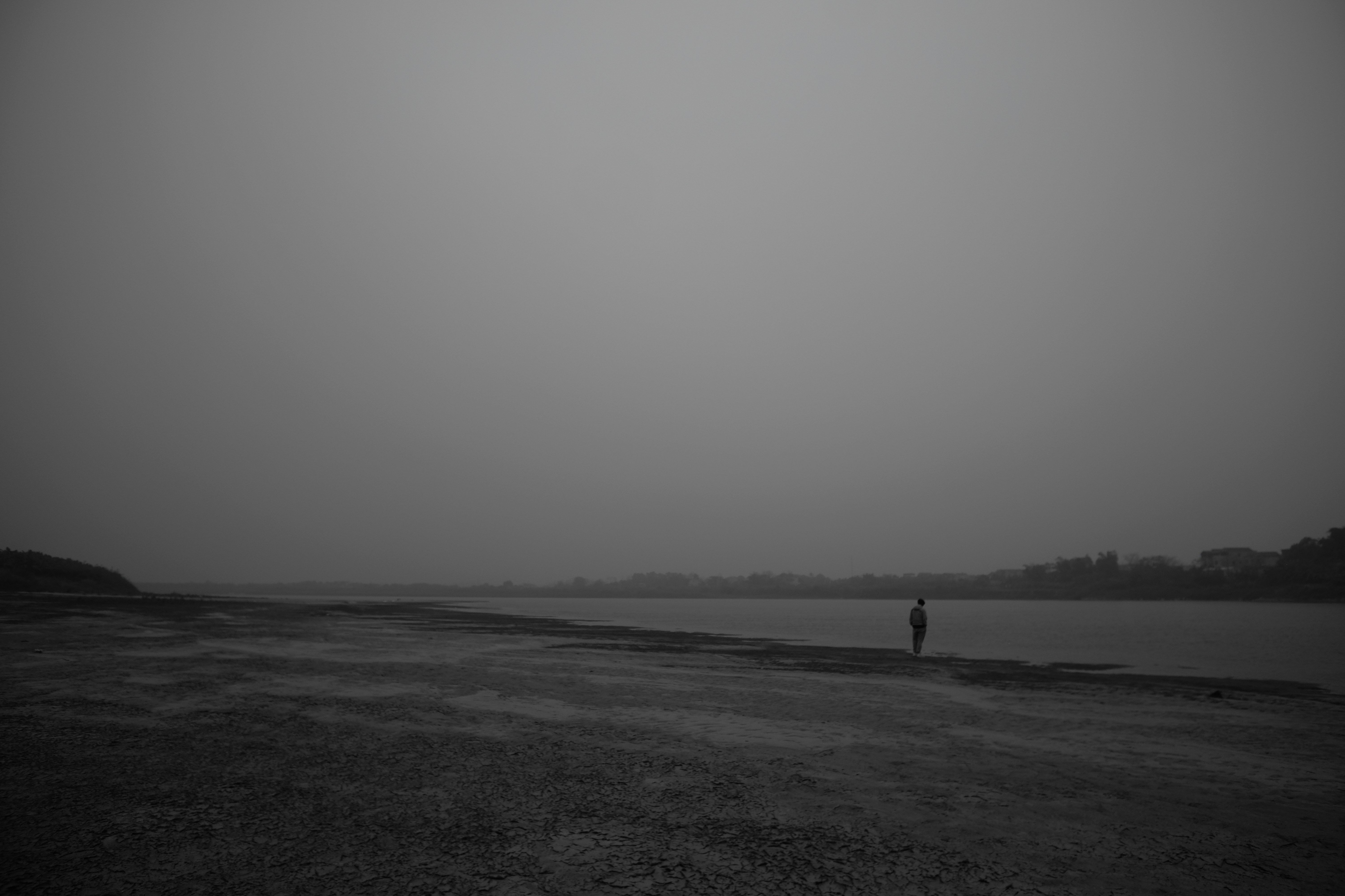 Silhouette at the Shore: A Single Figure on a Quiet Horizon