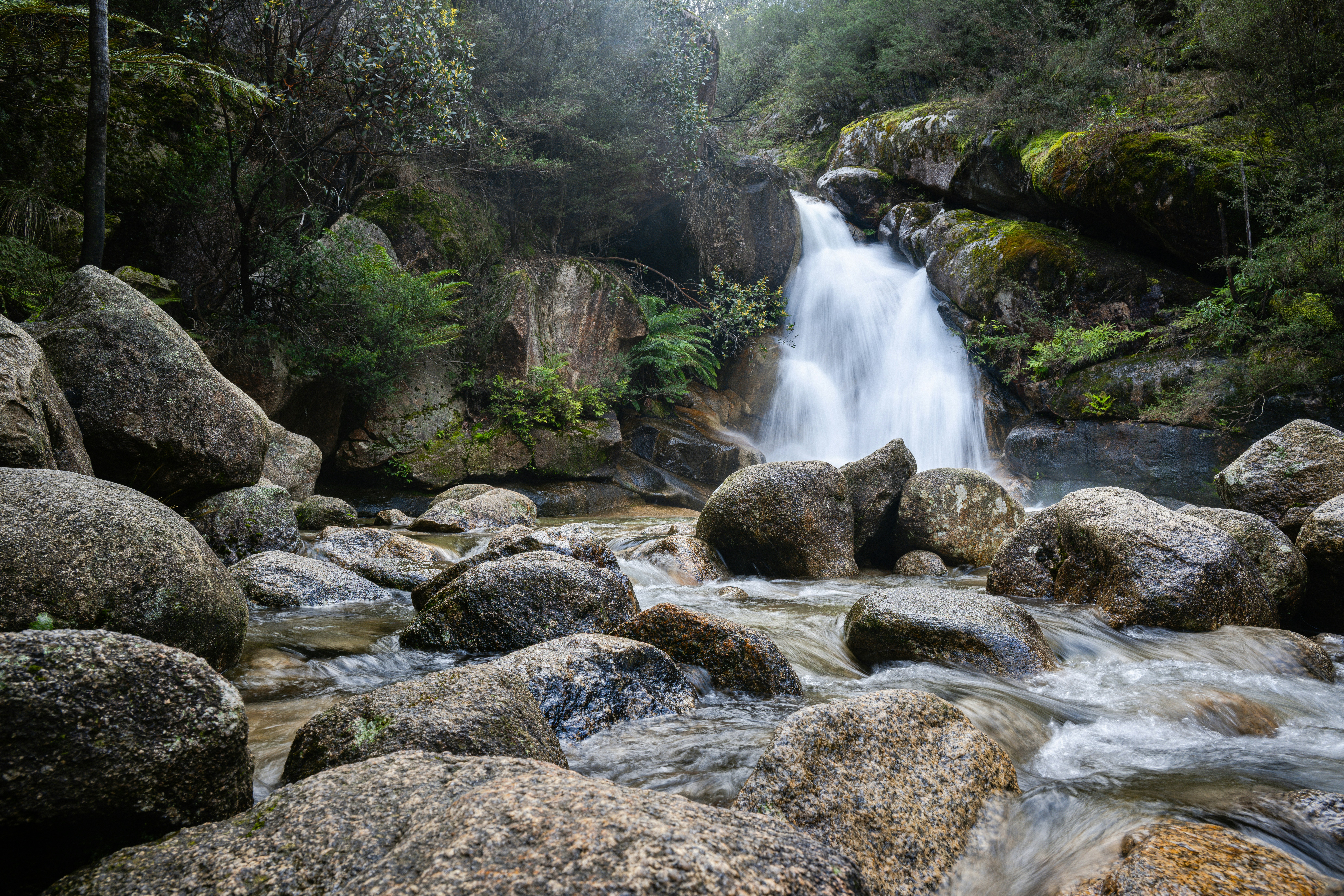 Whispering Cascade Between Granite Giants
