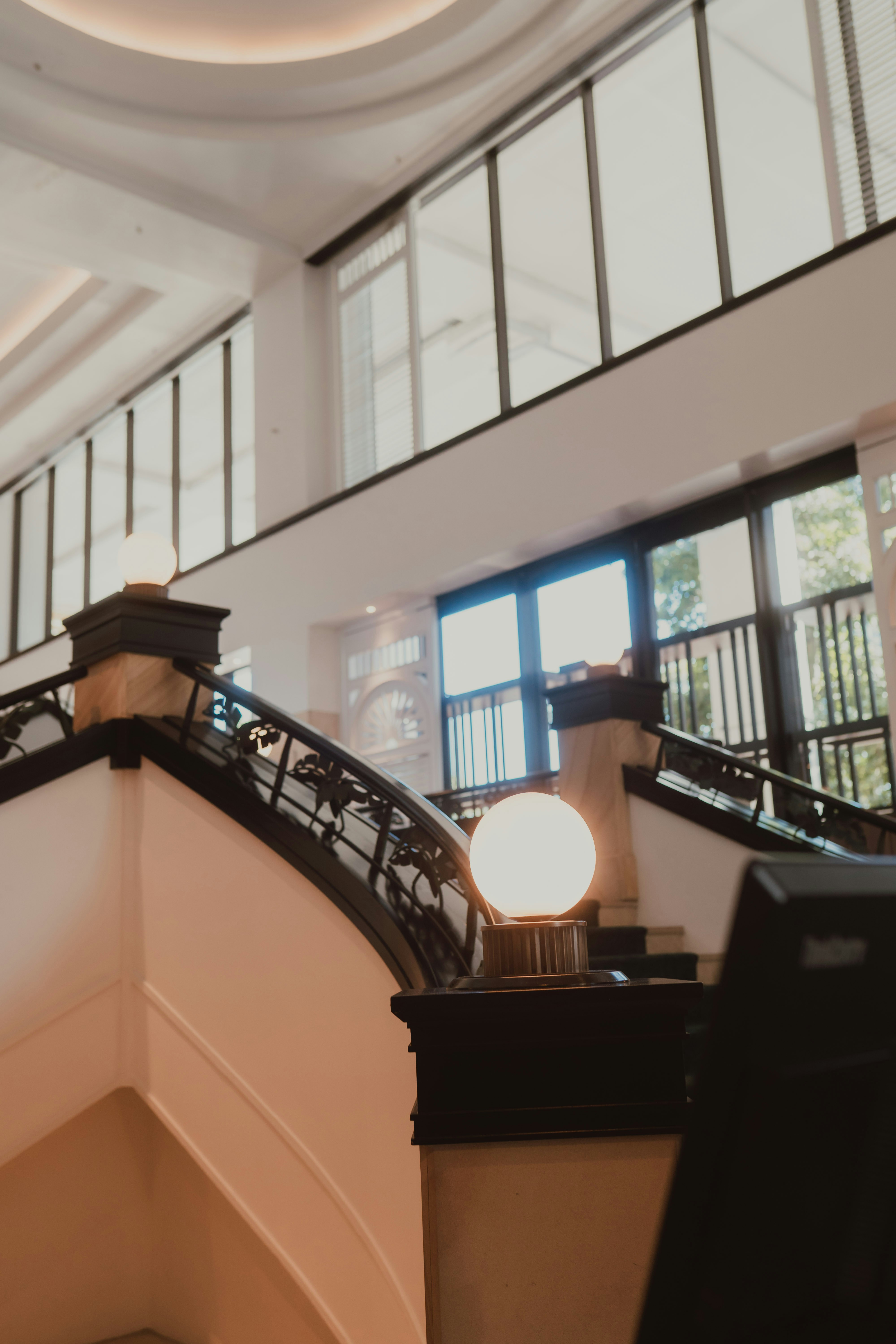 Grand Staircase Lamp: An Illuminated Touch in a Quiet Atrium