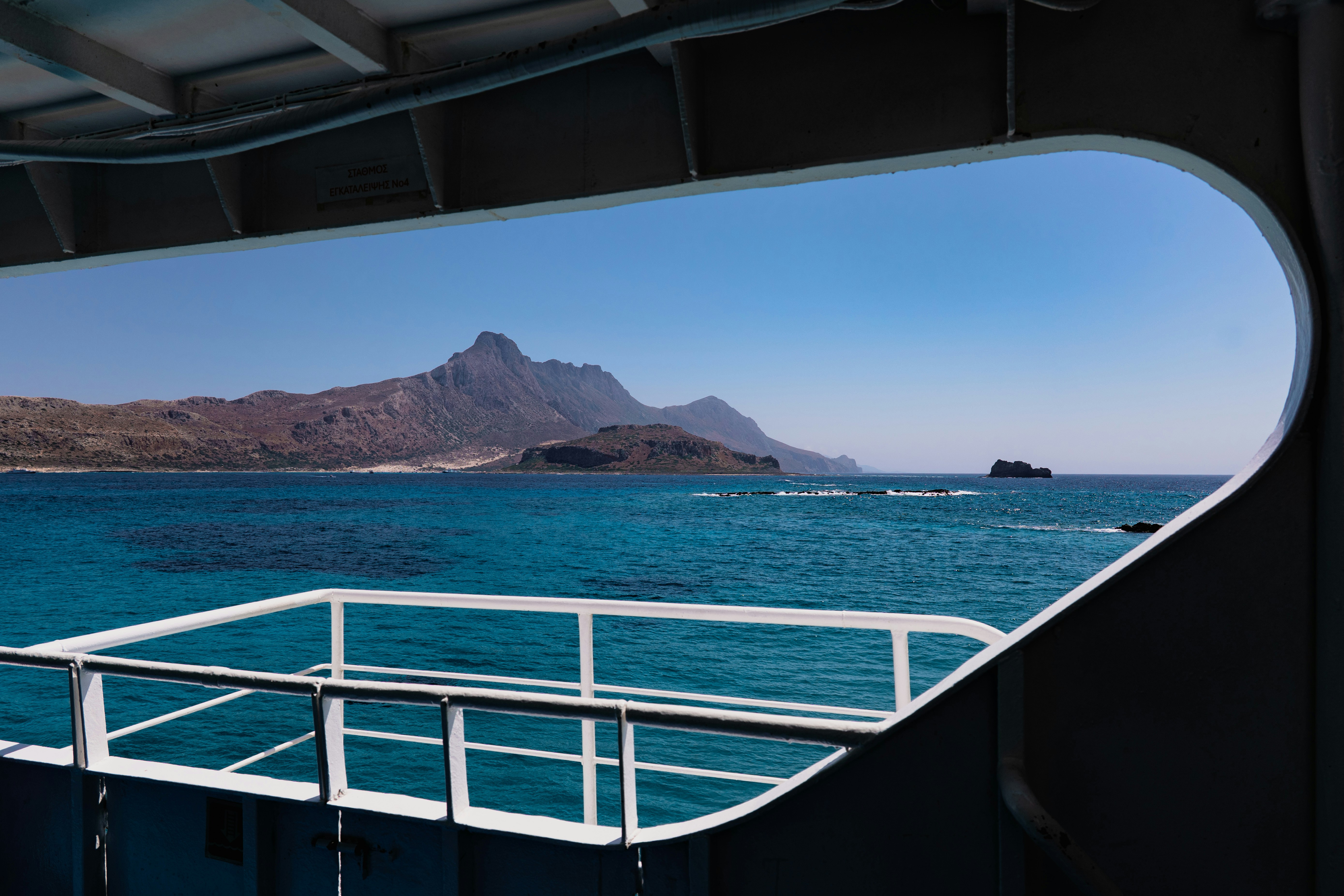 Framed Horizon: Ocean View Through a Ship Window