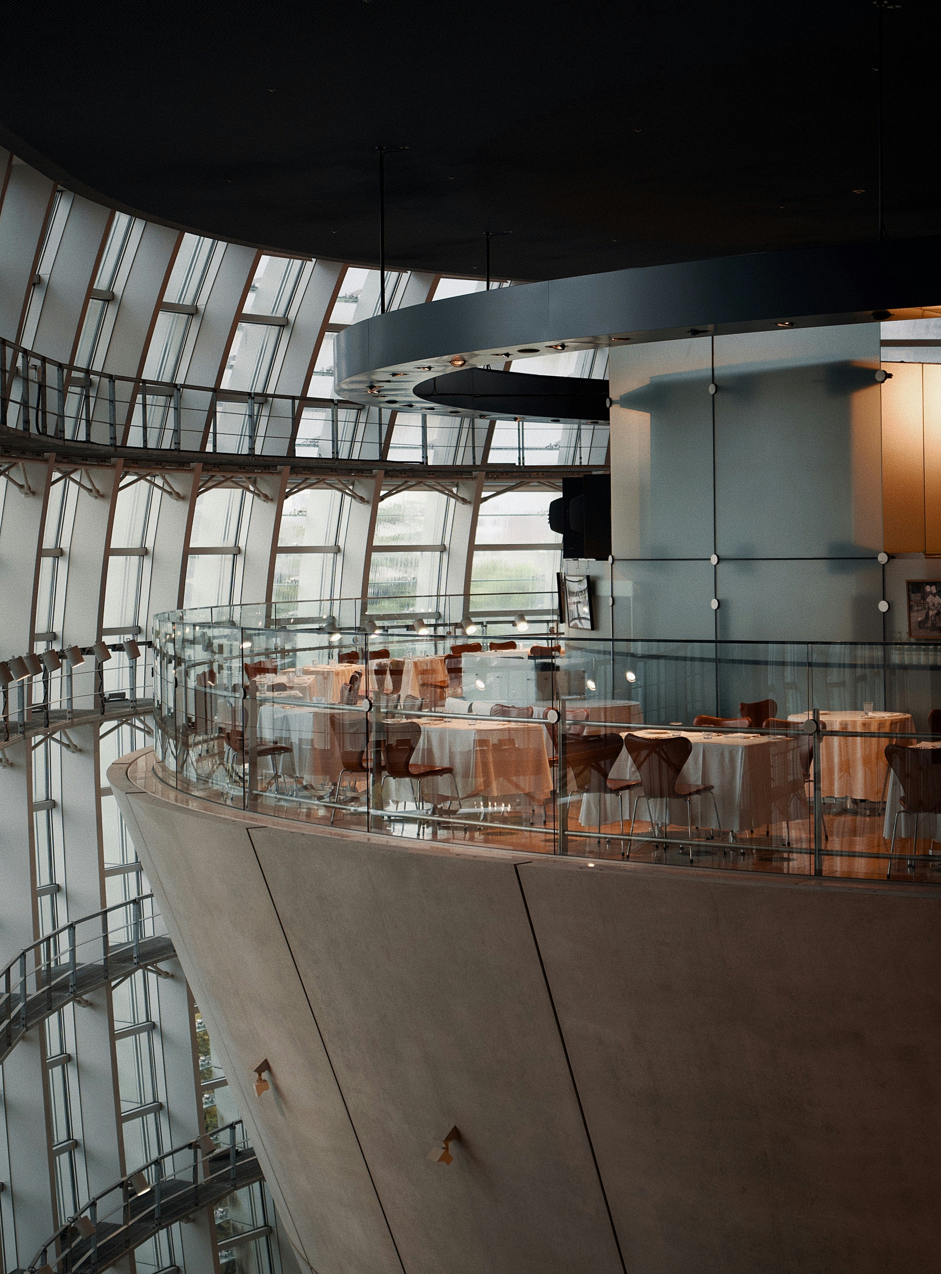 Aerial Café Overlook: Glass Balcony in a Modern Atrium