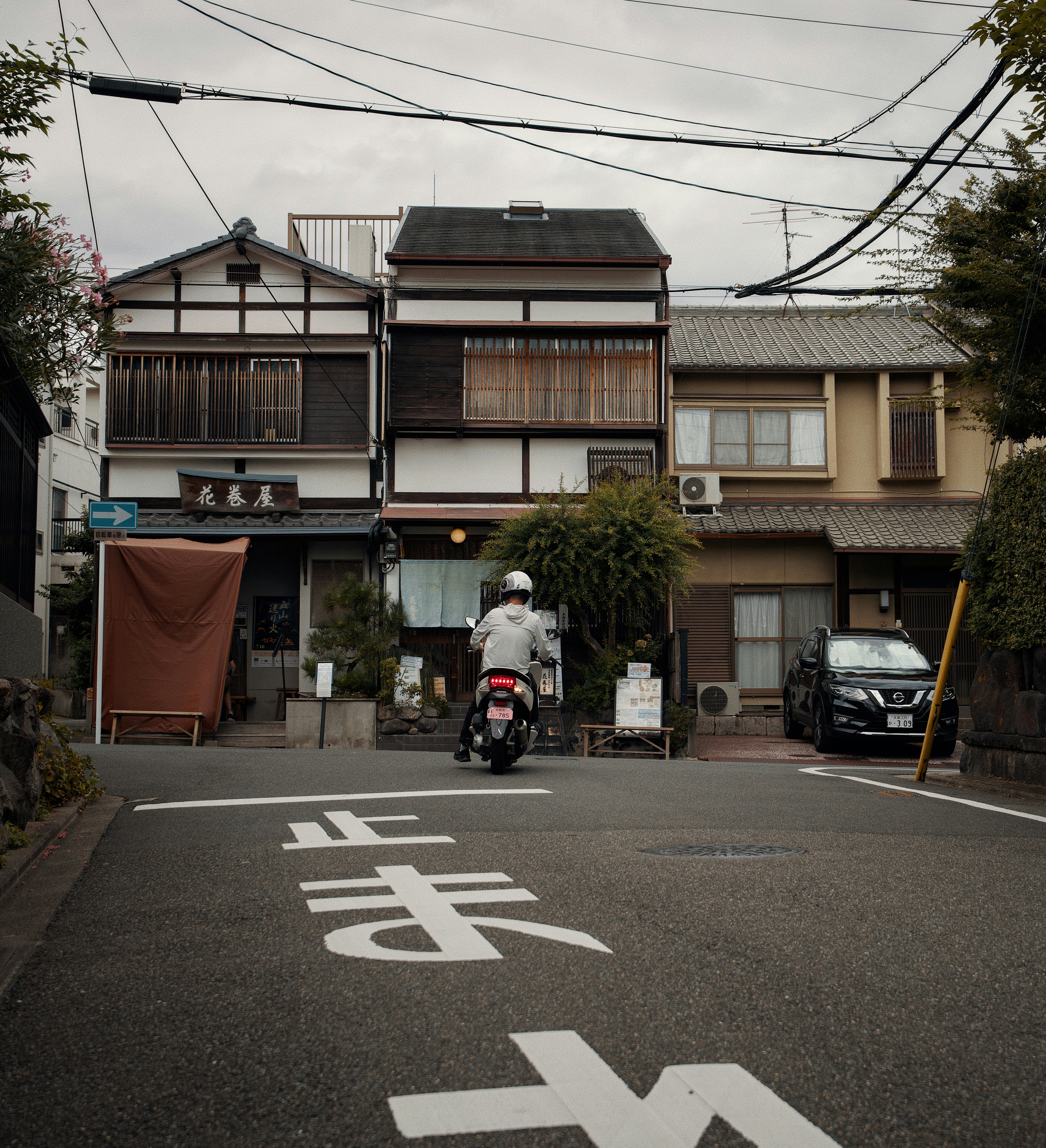 Motorcyclist at a Quiet Japanese Street Corner