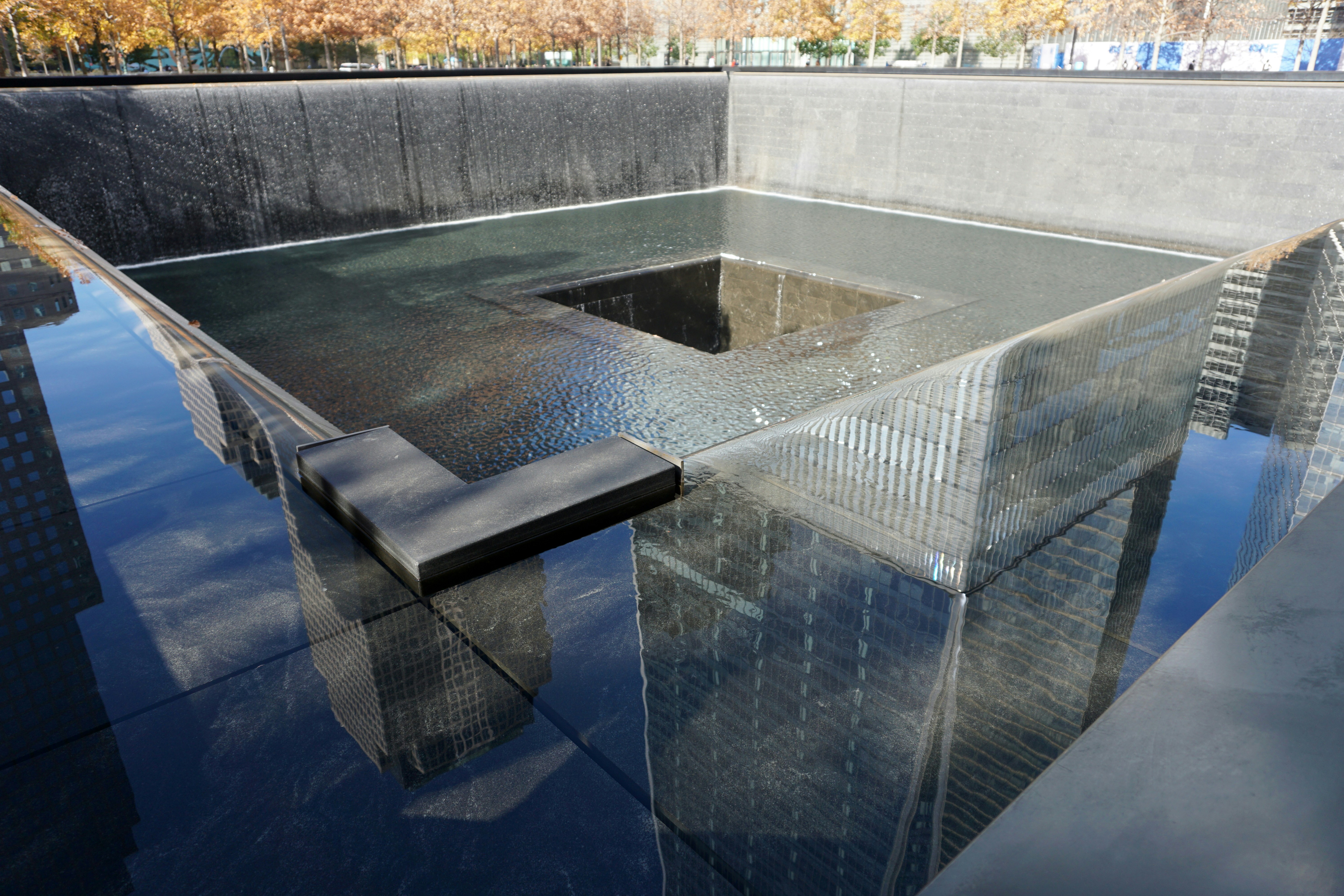 Reflective Abyss: The Sunken Plaza Within Glacial Glass