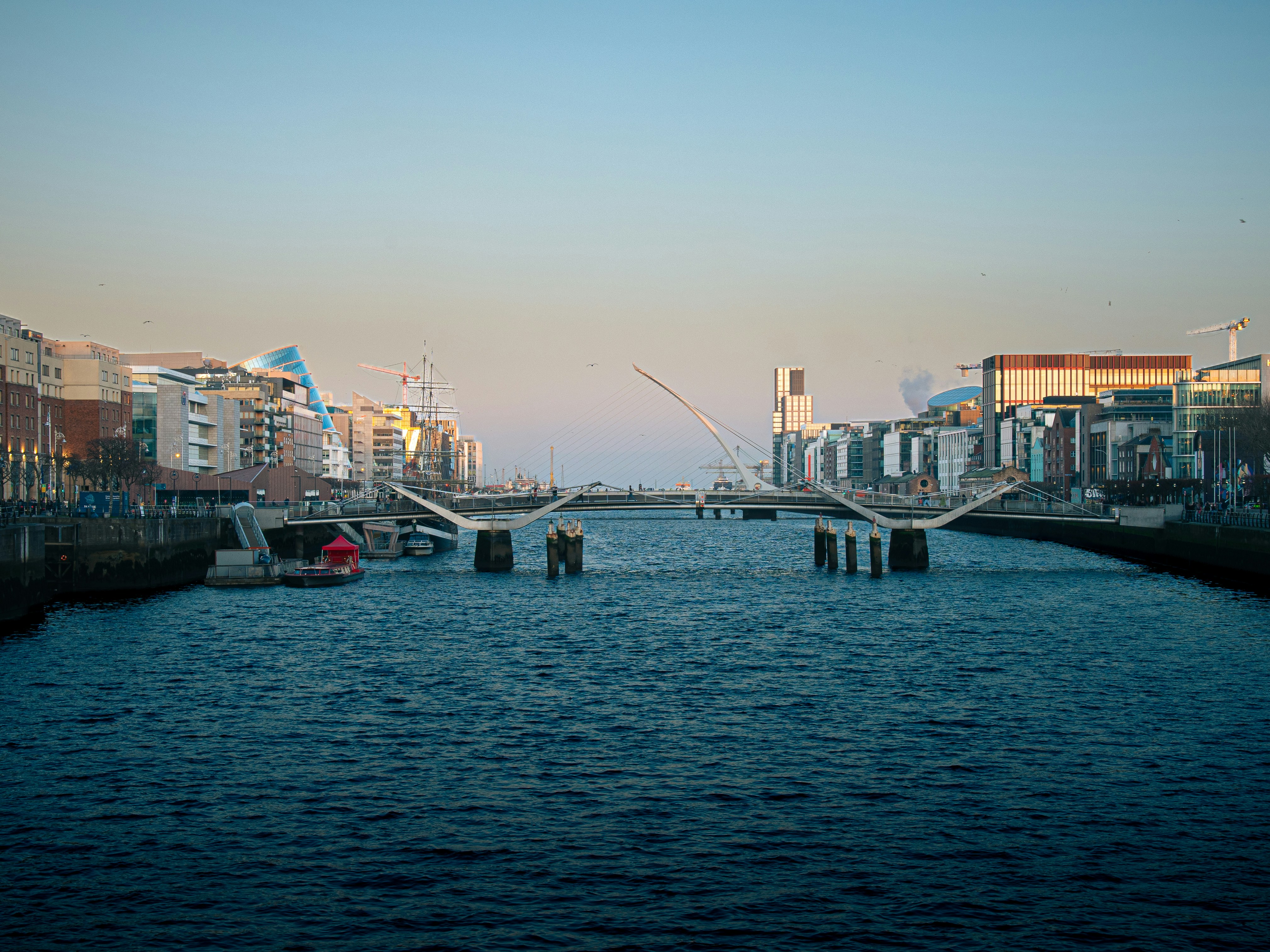 Cityscape Confluence: A Calm Channel Framed by Modern Bridges