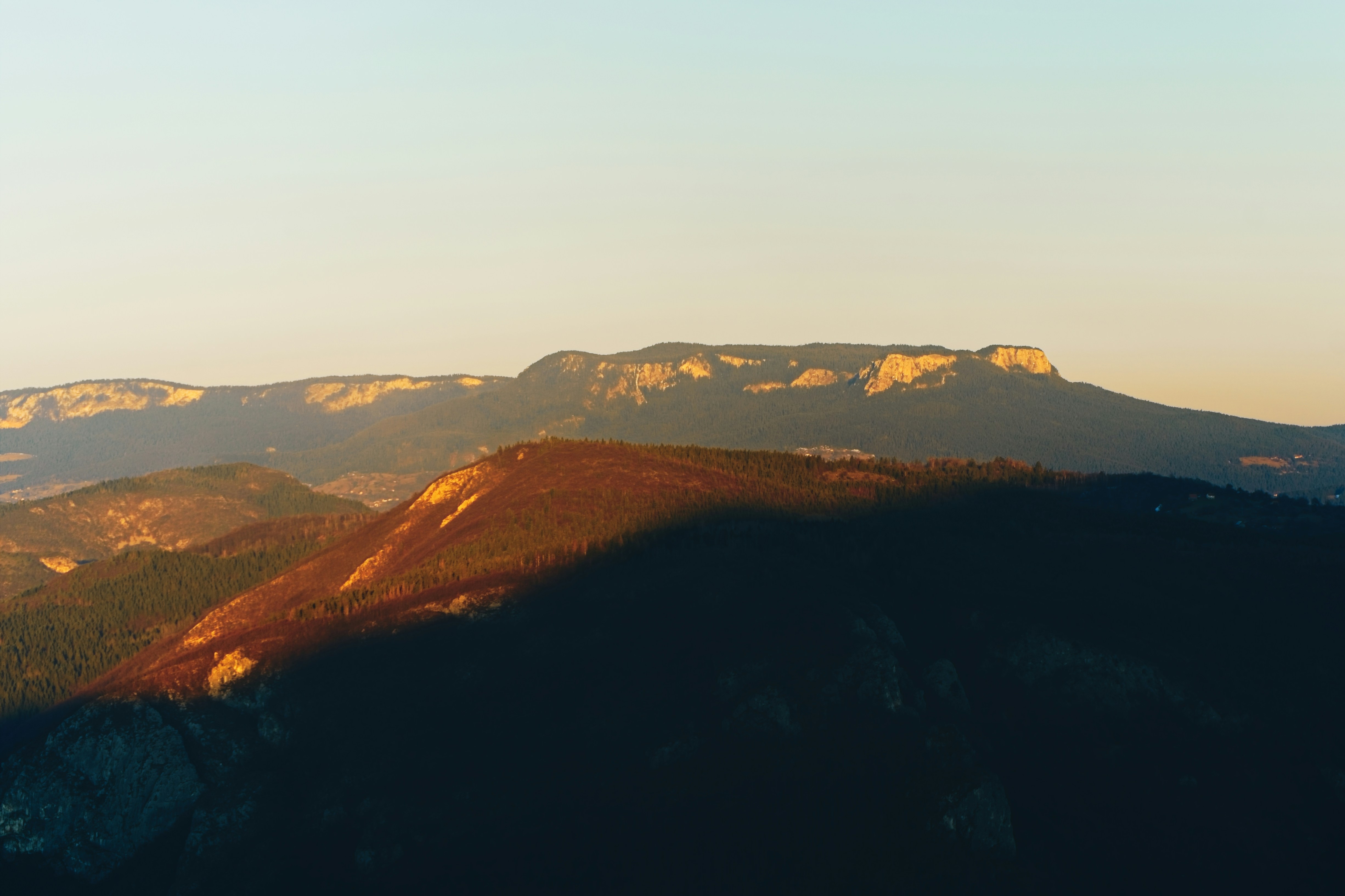 Golden Crest: Sunlit Ridge Beyond the Shadowed Vale