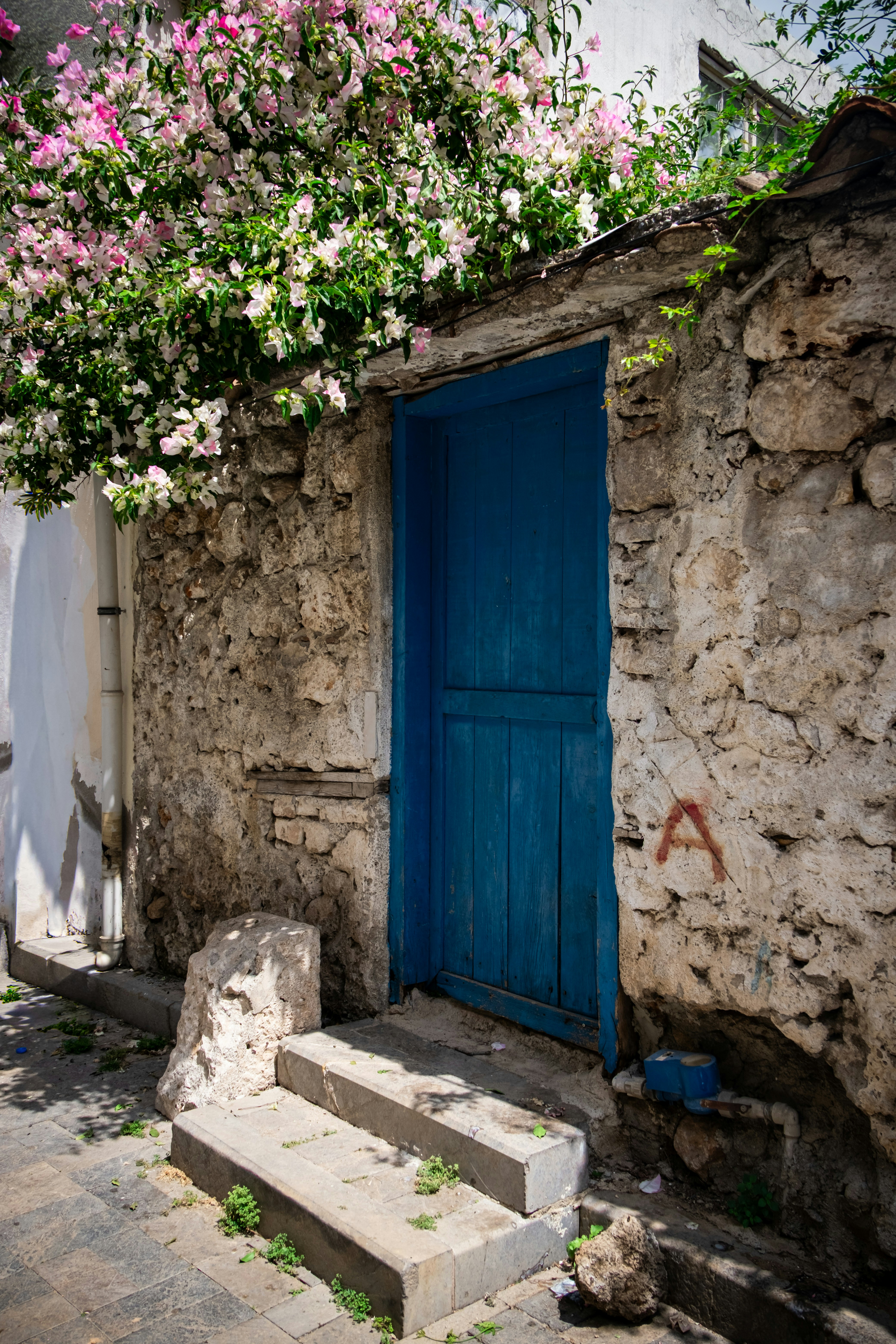Azure Doorway in a Crumbling Stone Street
