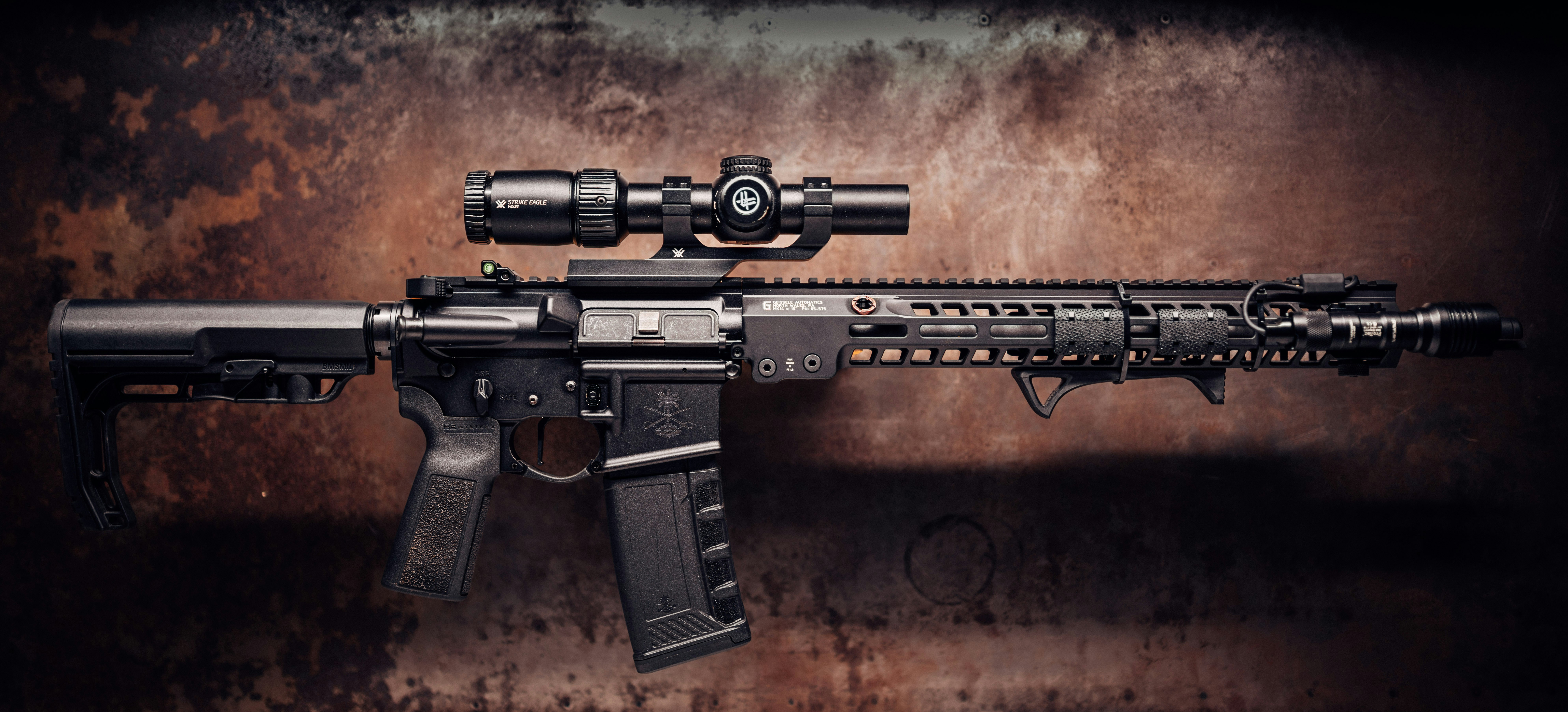 Precision in Steel: A Tactical Rifle Across a Textured Backdrop
