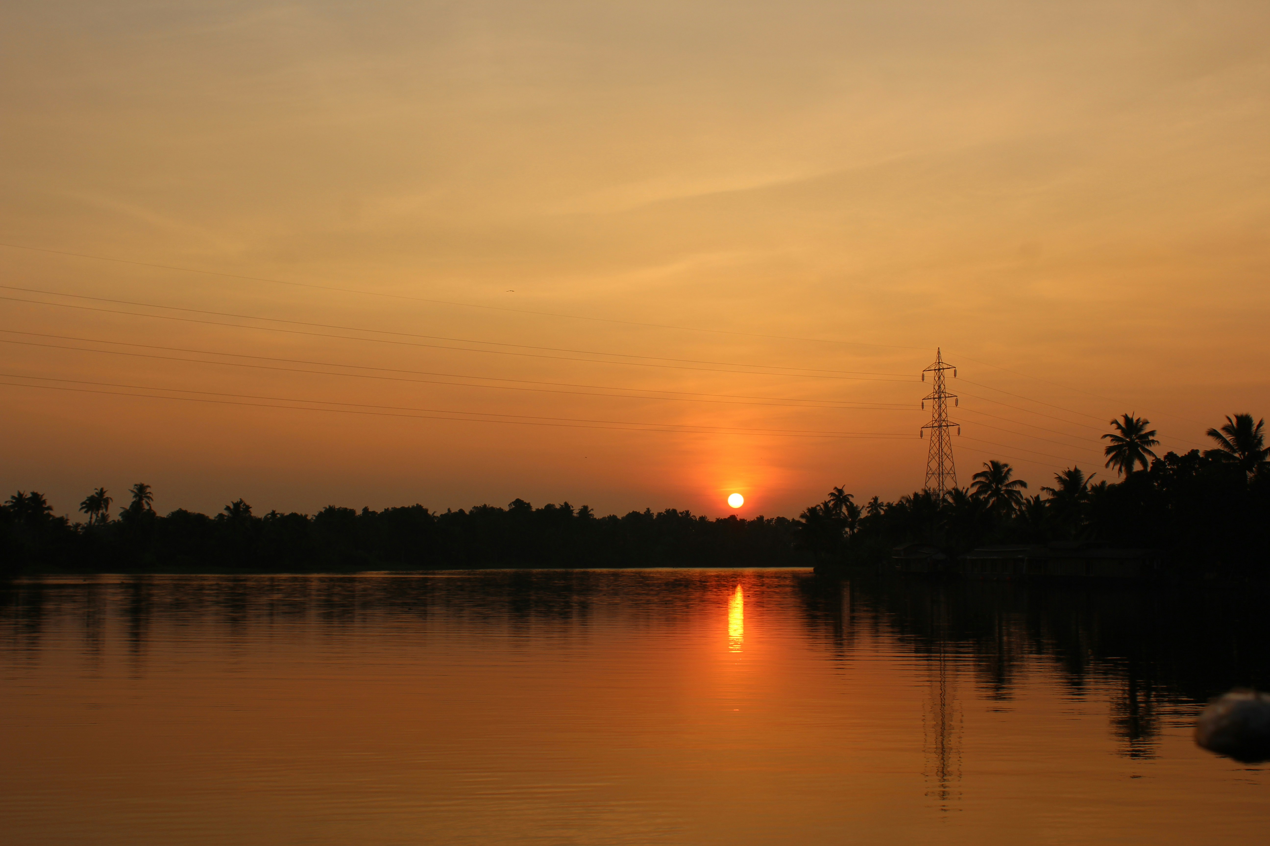Sunset Confluence: Calm Water Reflects a Quiet Horizon
