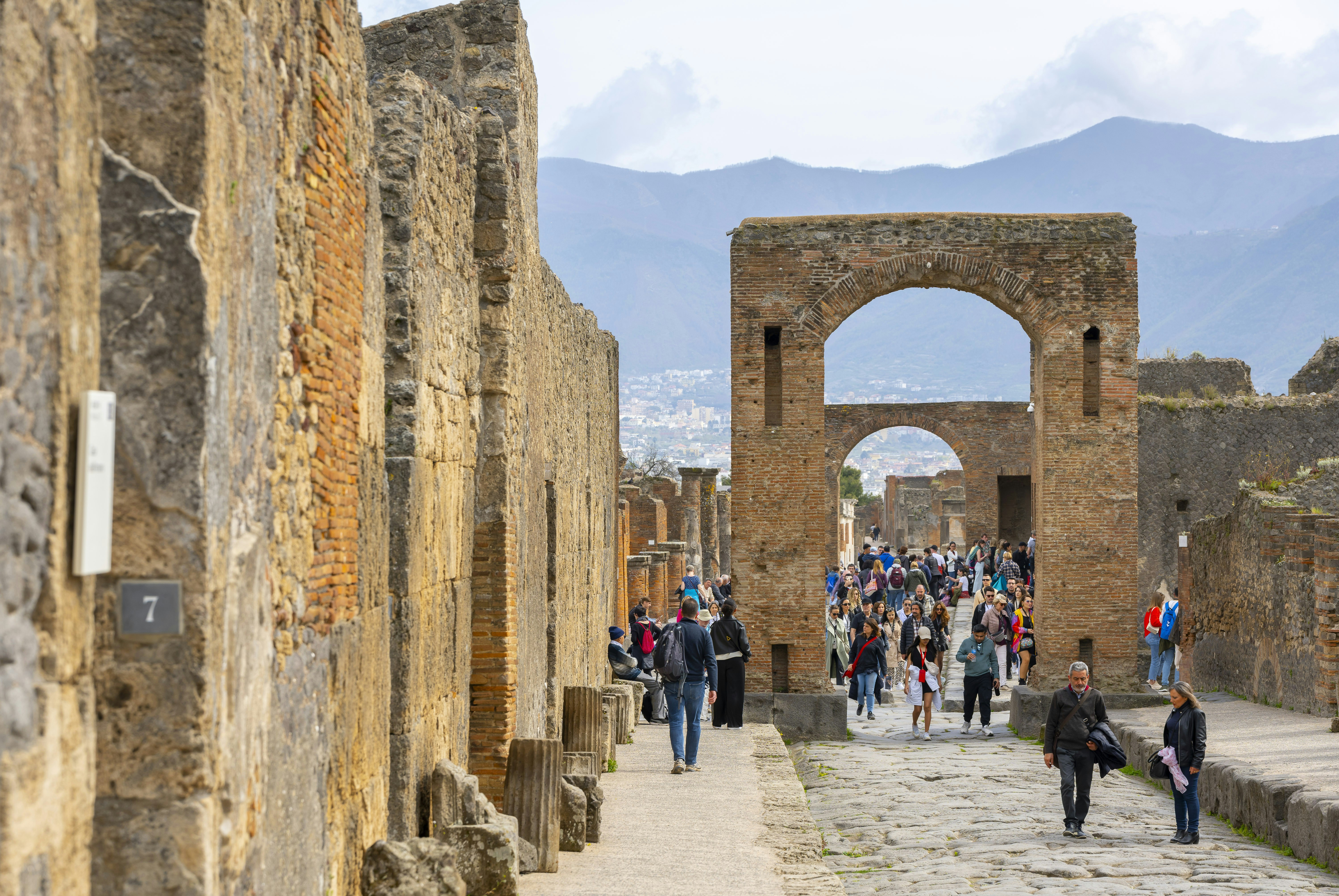 Through the Arched Gateway: A River of Travelers in an Ancient Passage