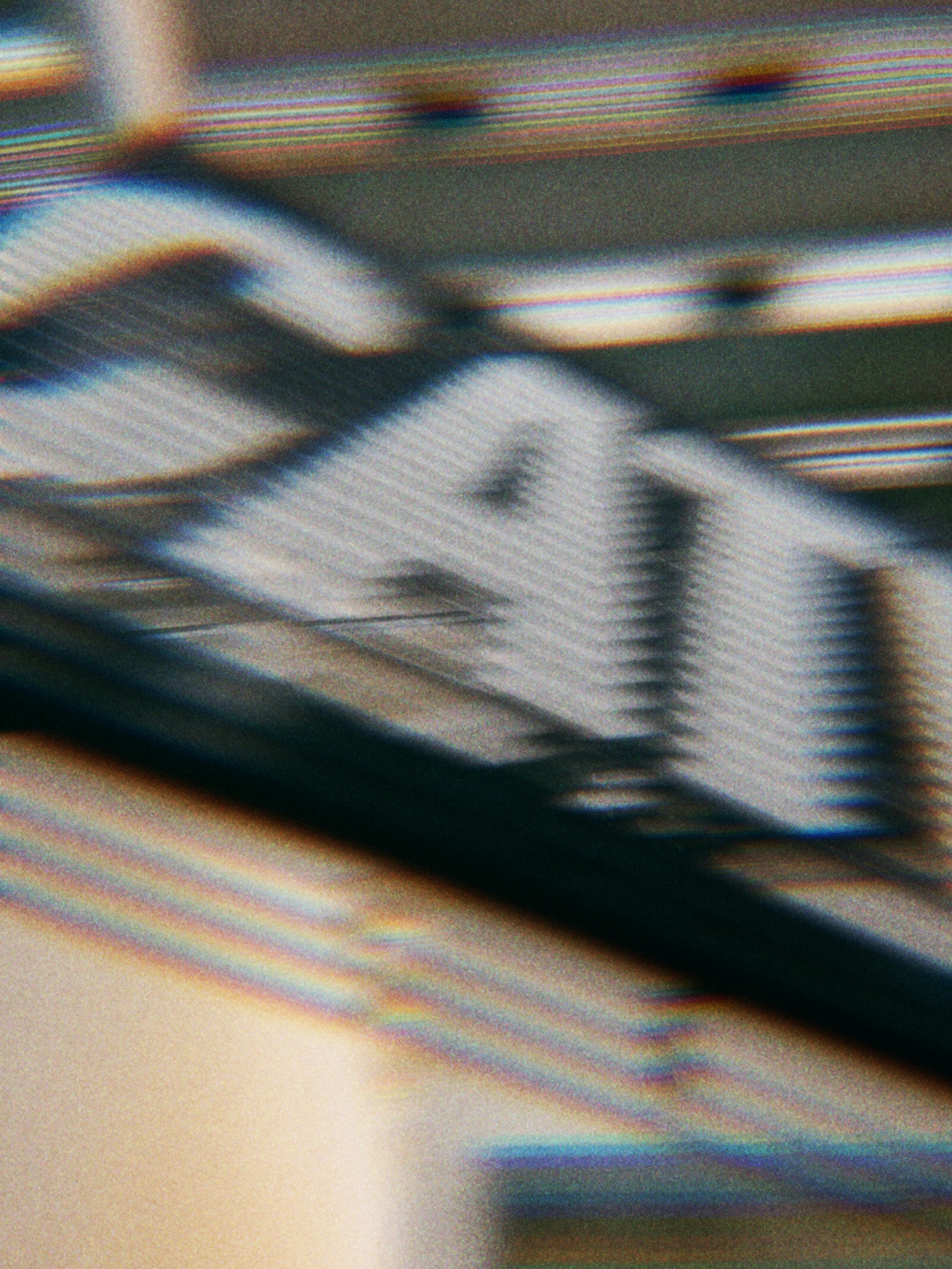 Tilted Rooftops and Striated Light: Abstract Urban Blur