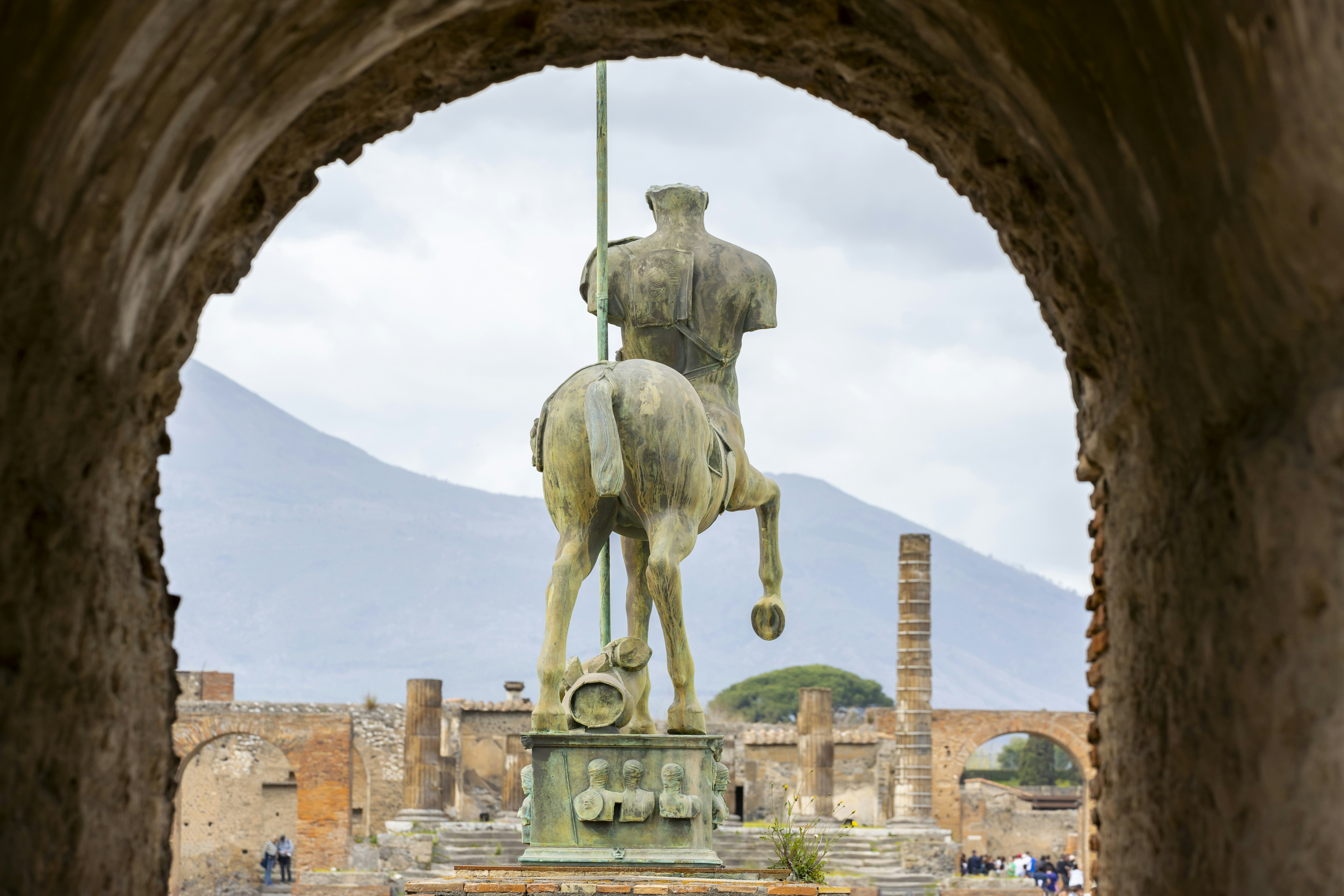 Statue in the Arch: Rider on a Spear amidst Ancient Ruins