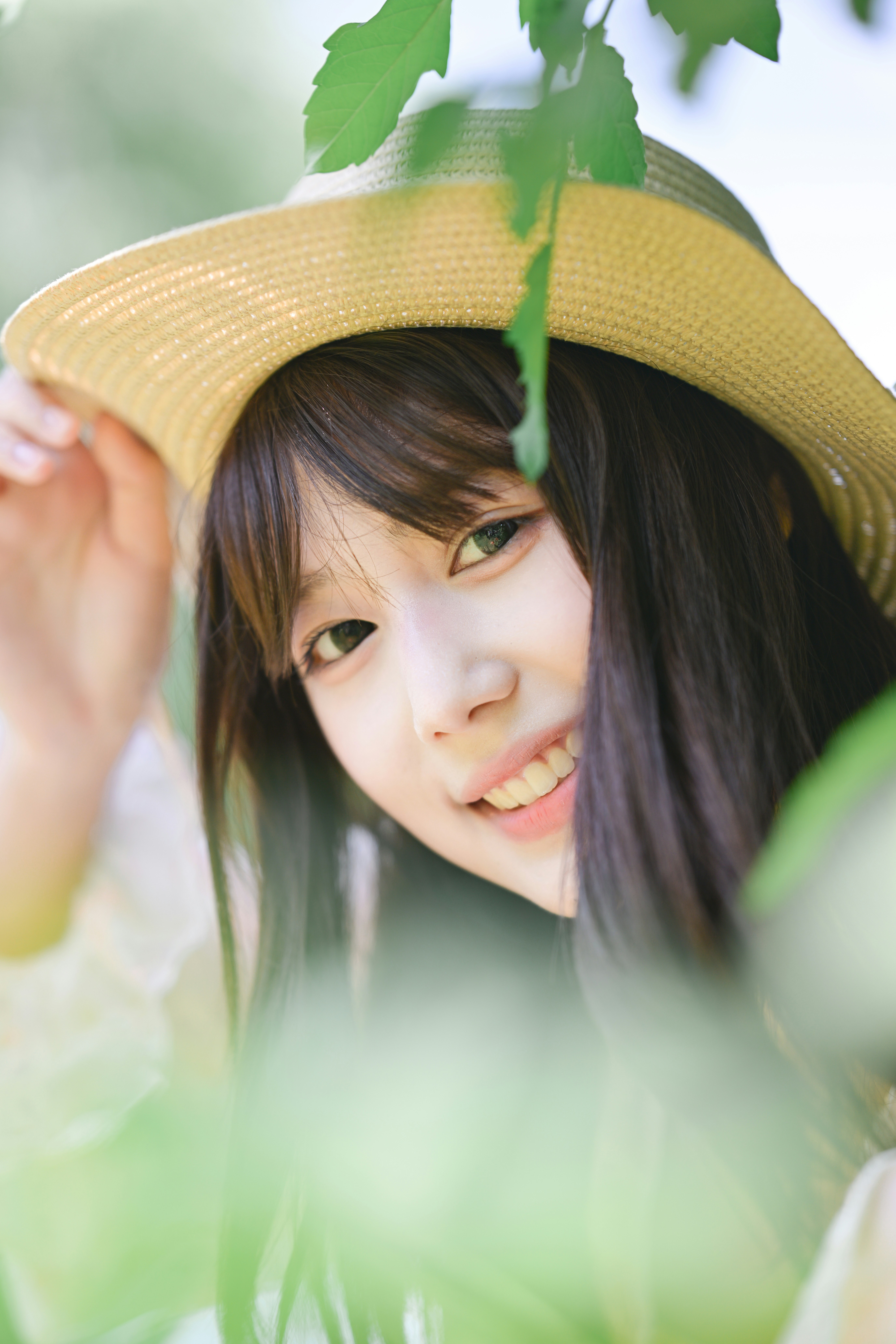 Smile in the Sunlit Hat: a Portrait Through Green Veils