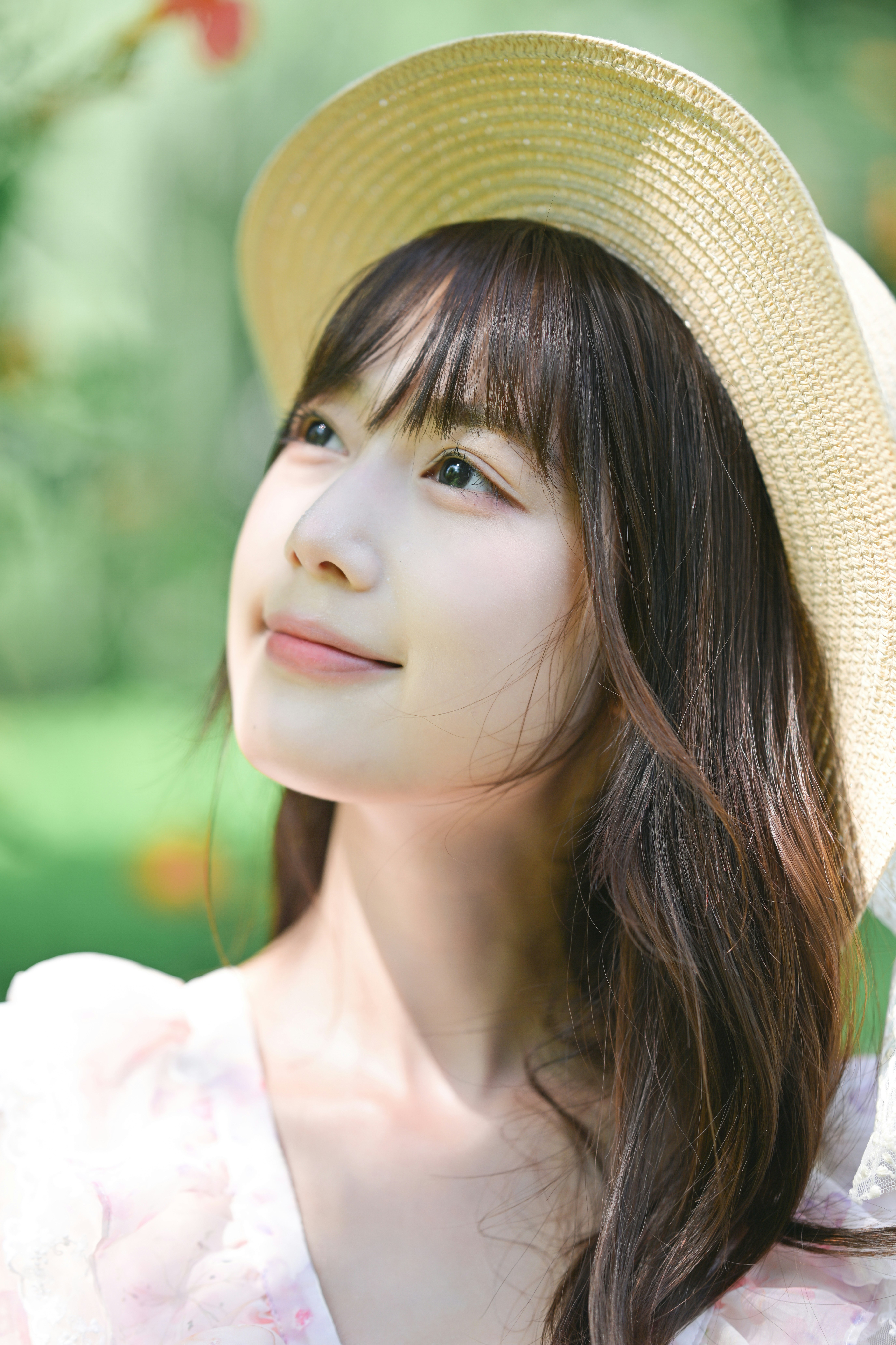 Sunlit Portrait: Quiet Confidence Beneath a Straw Hat