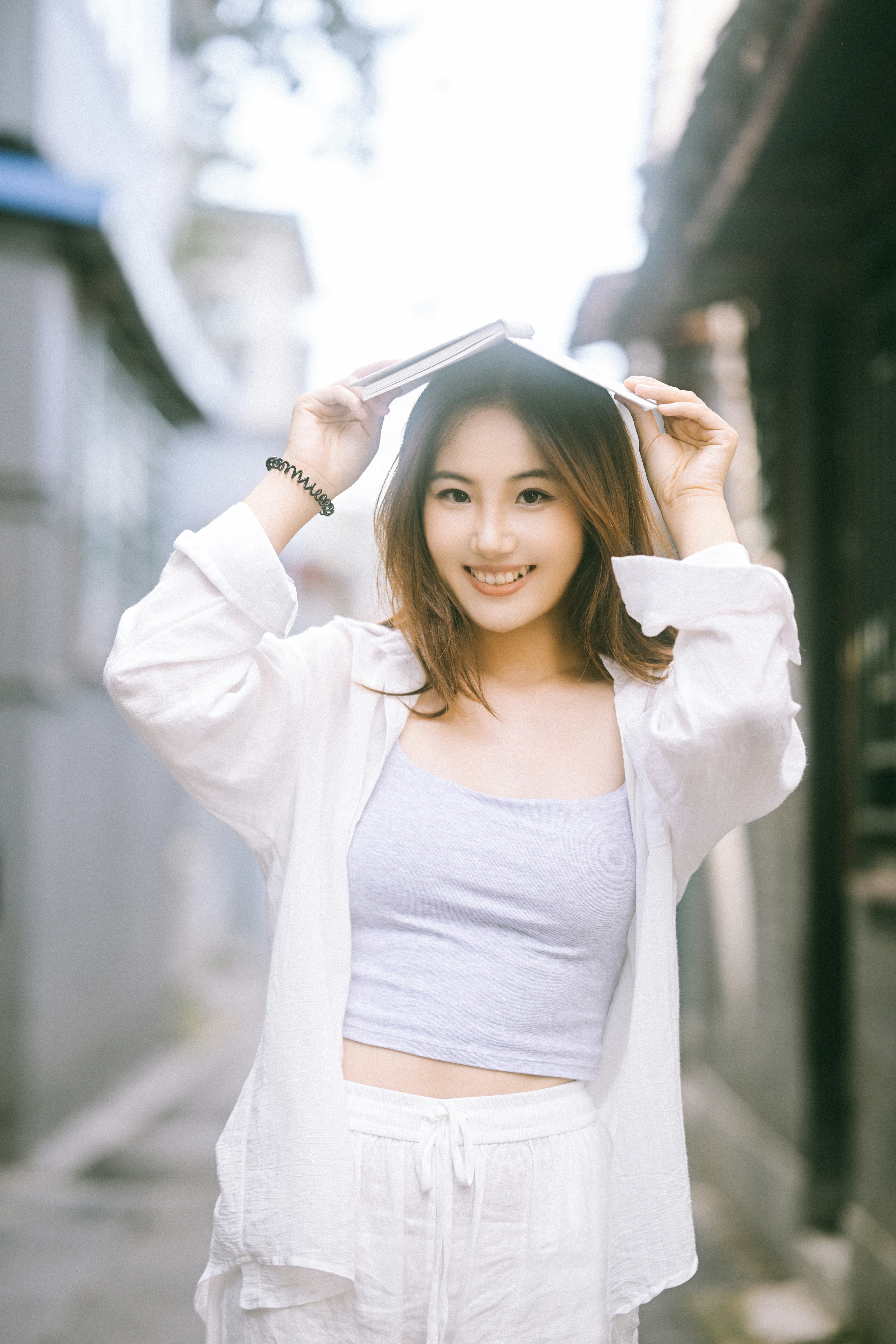 Smiling Portrait Under a Playful Fold of Light