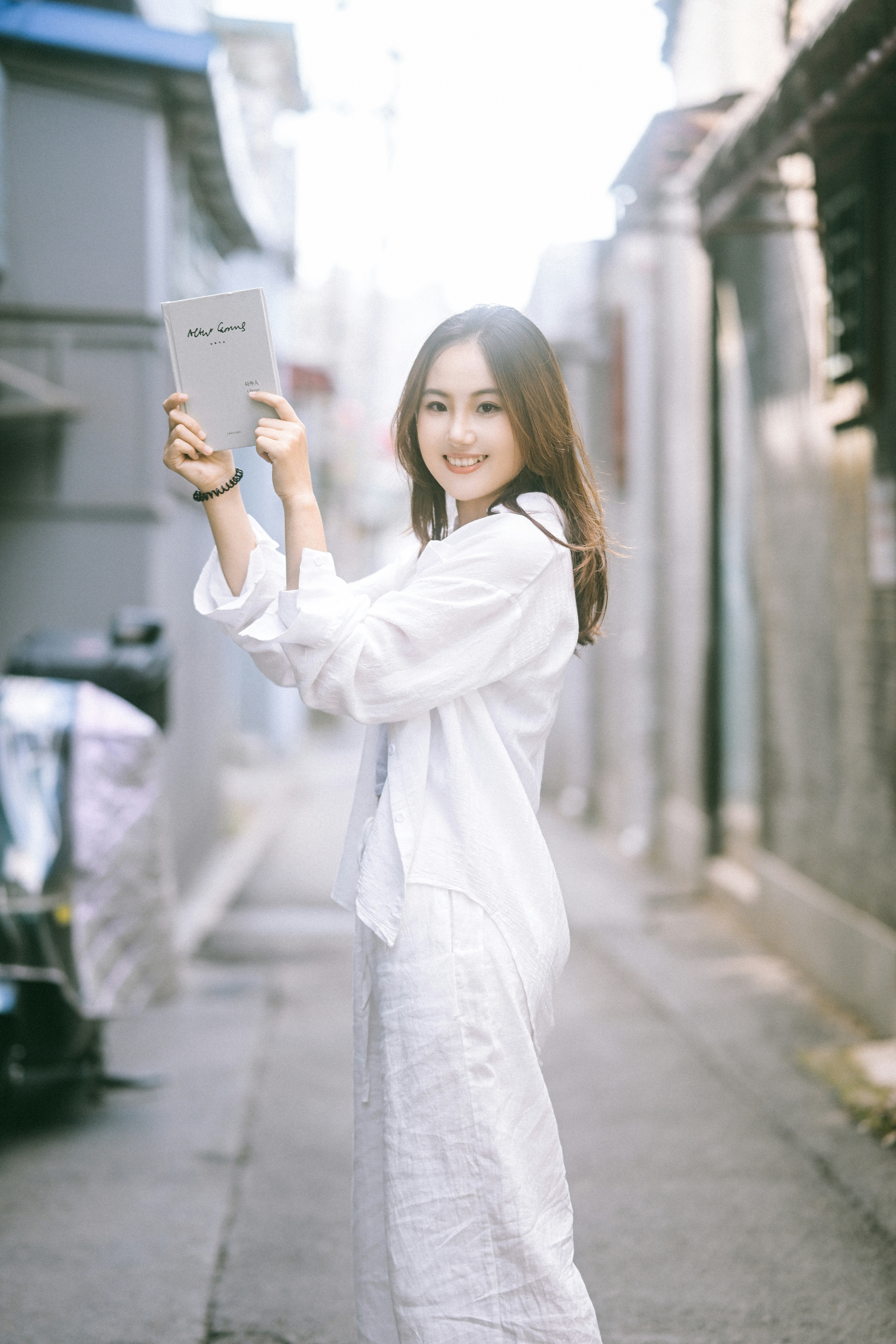Soft Light, Bright Smile: A Portrait in a Quiet Alley