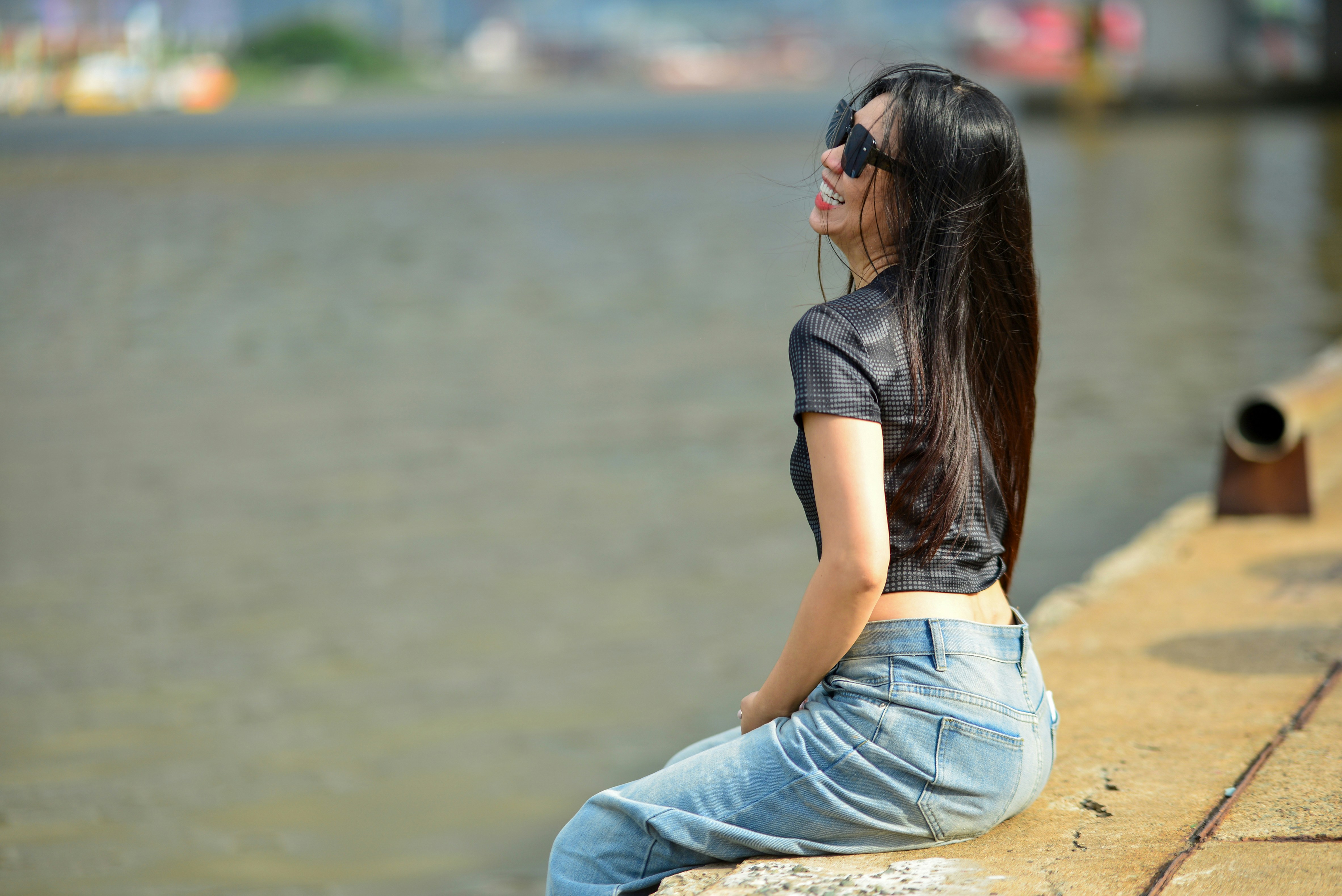 Sunlit Riverside Moment: A Quiet Portrait by the Pier